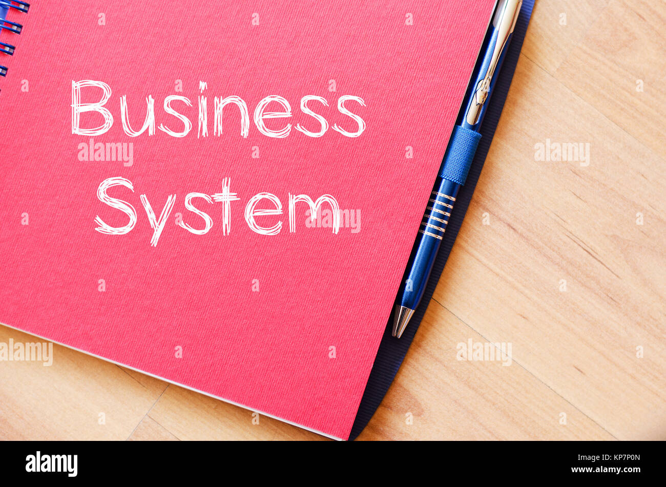 Business system write on notebook Stock Photo - Alamy