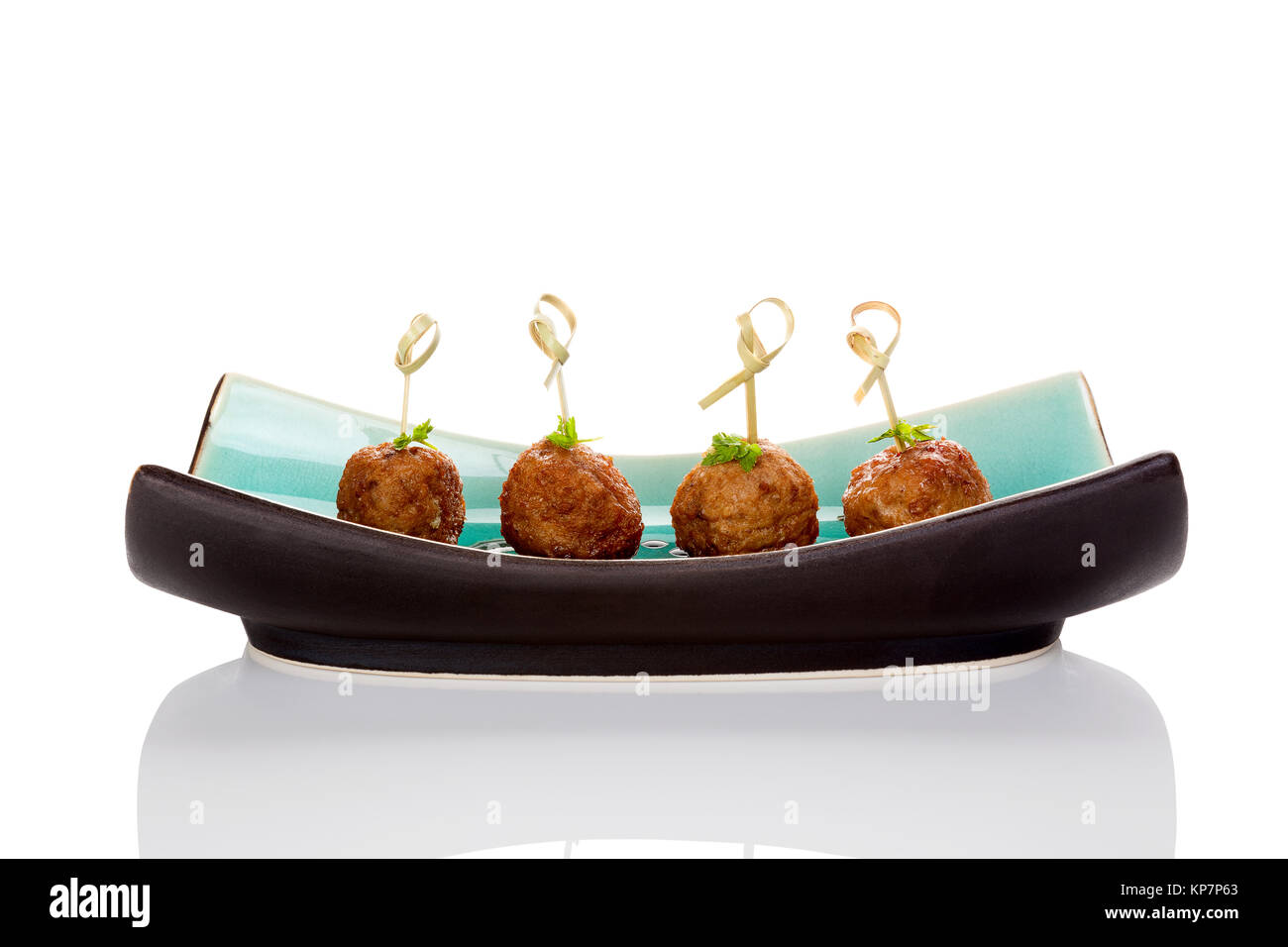 Meatballs canape on ceramic tray isolated on white background. Culinary ...