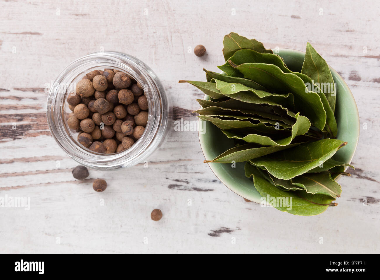 Dry bay leaves on white wooden textured background. Culinary herb ...
