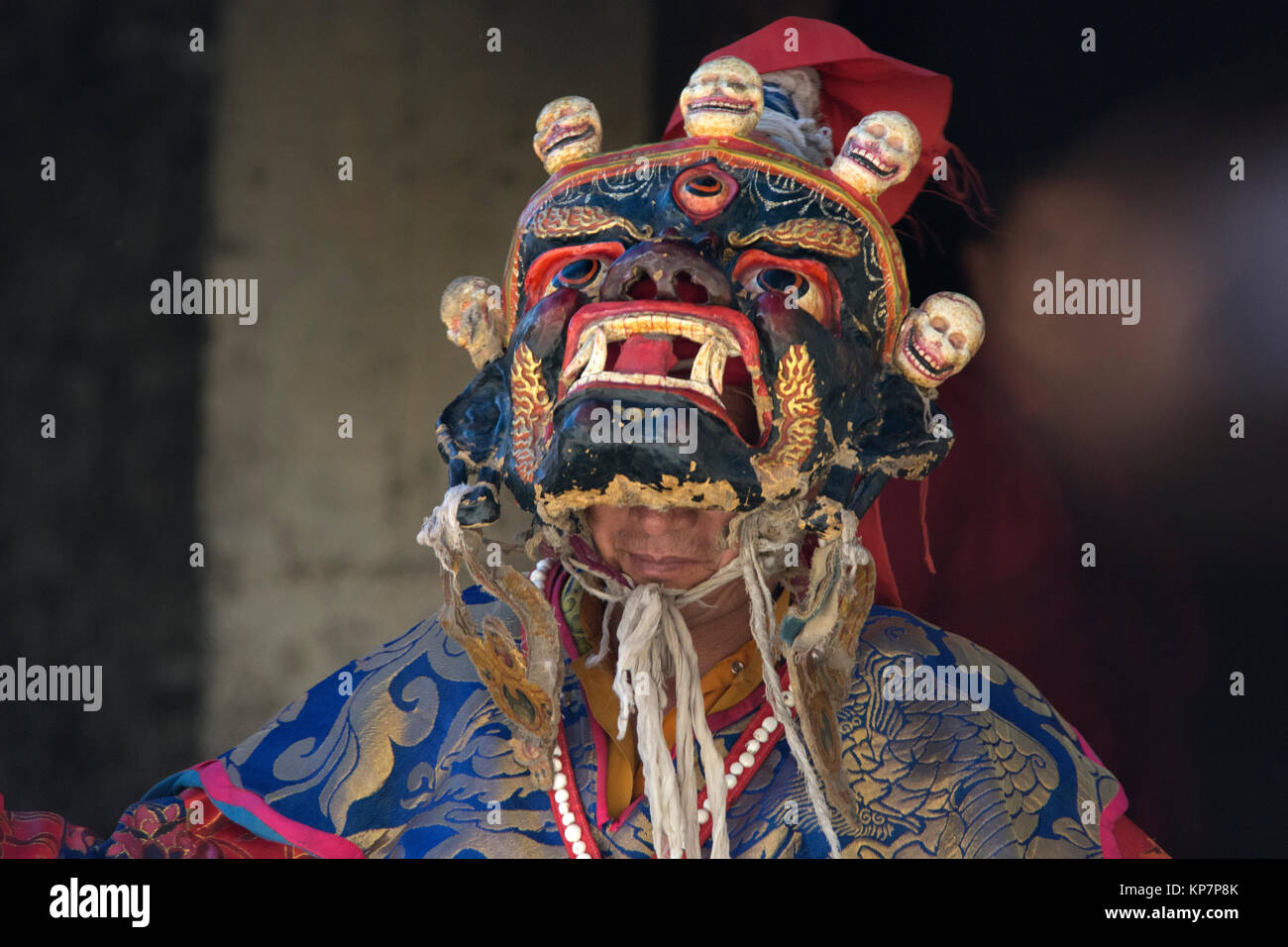 Ancient tantric ritual mask on the head of a Buddhist monk, you can see ...