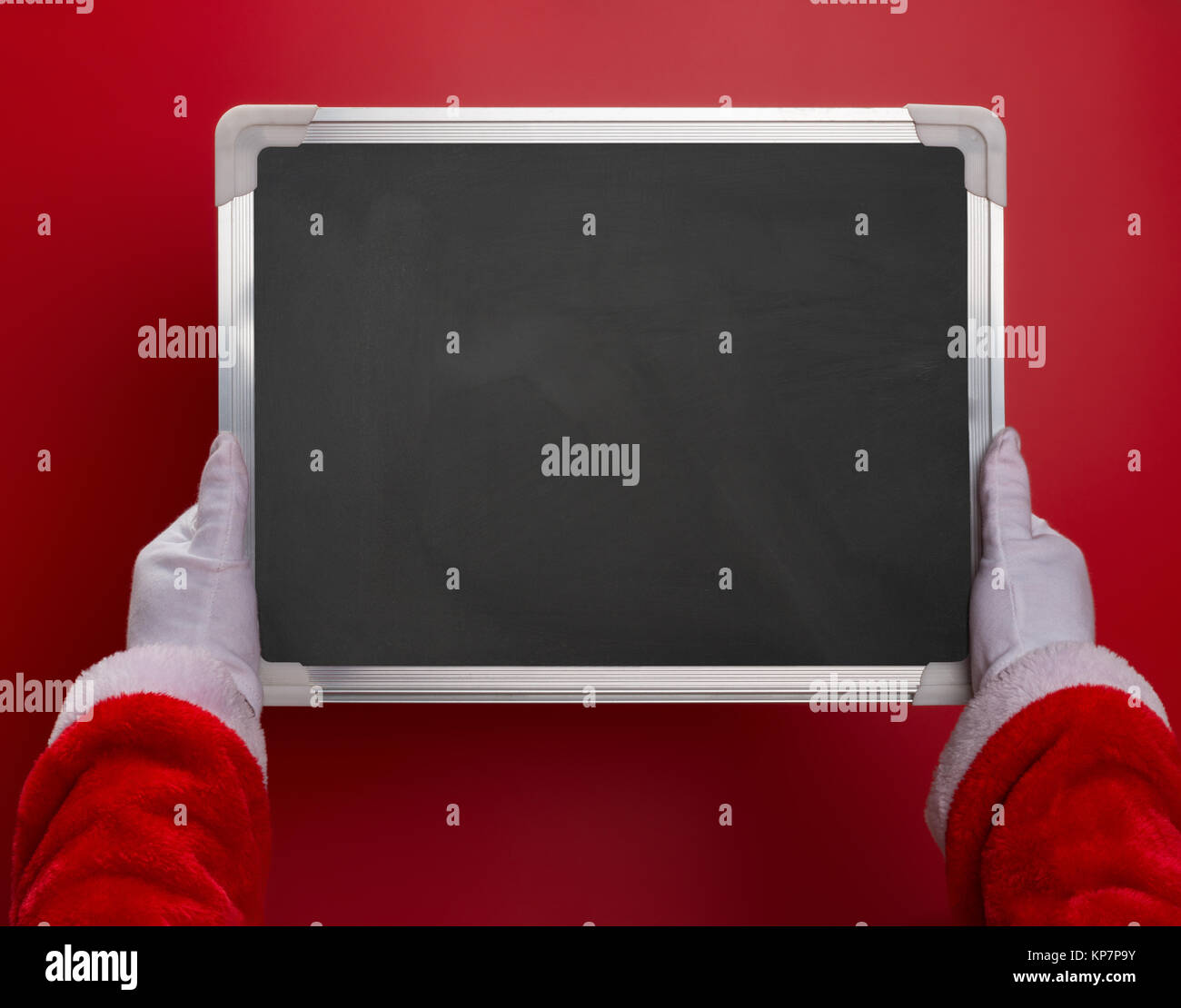 first person angle view of Santa Claus holding a blank chalk board good ...