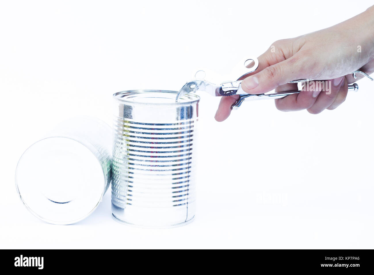 Close-up tin can with hand isolated on white background Stock Photo - Alamy