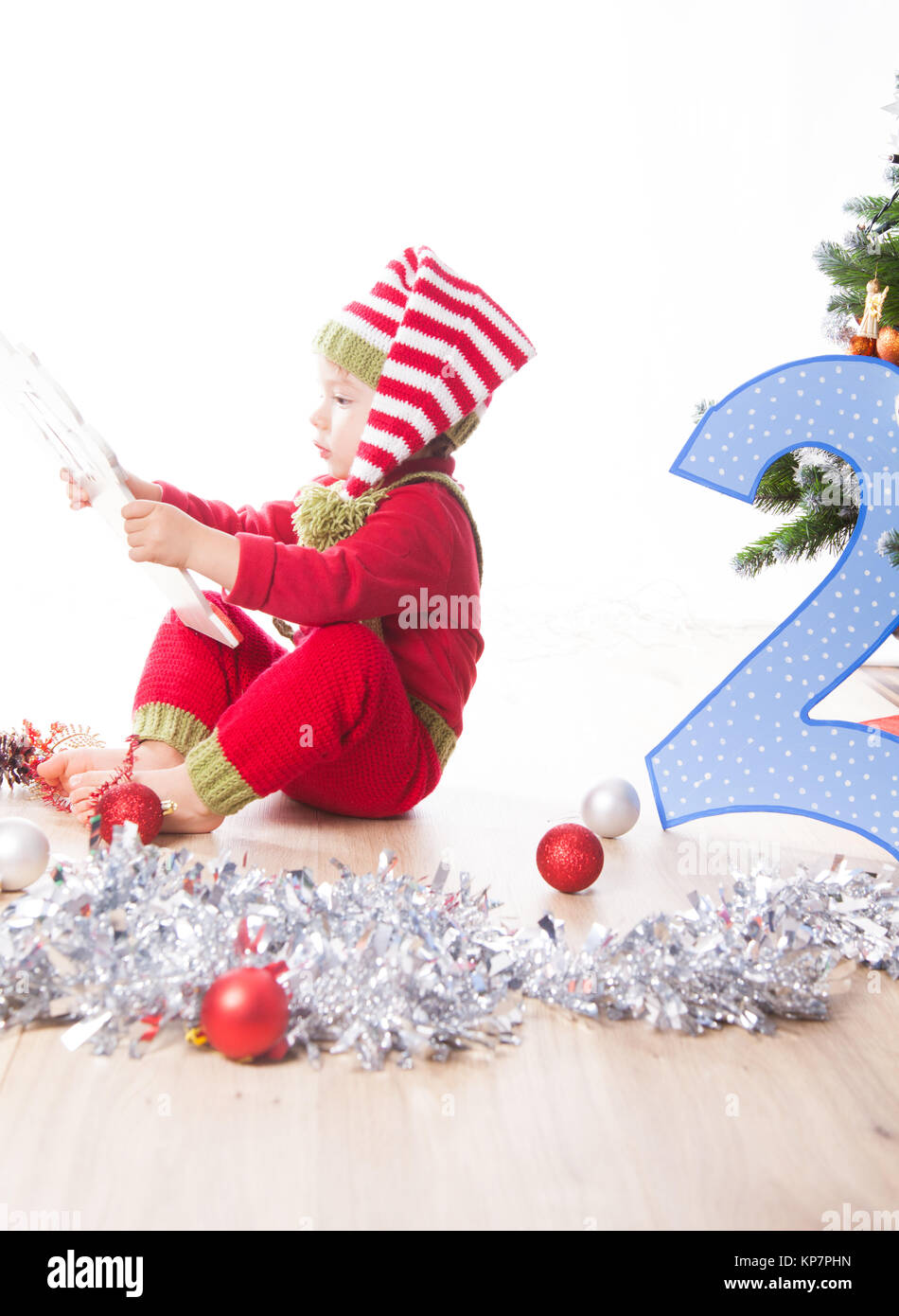 Baby boy dressed as elf Stock Photo - Alamy