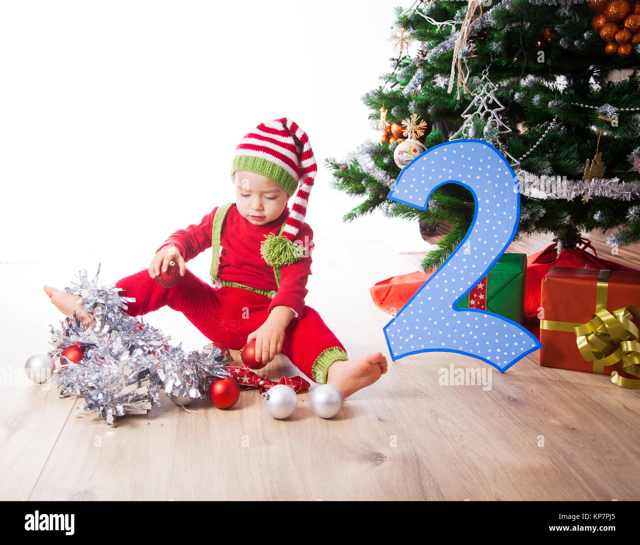 Baby boy dressed as elf Stock Photo - Alamy