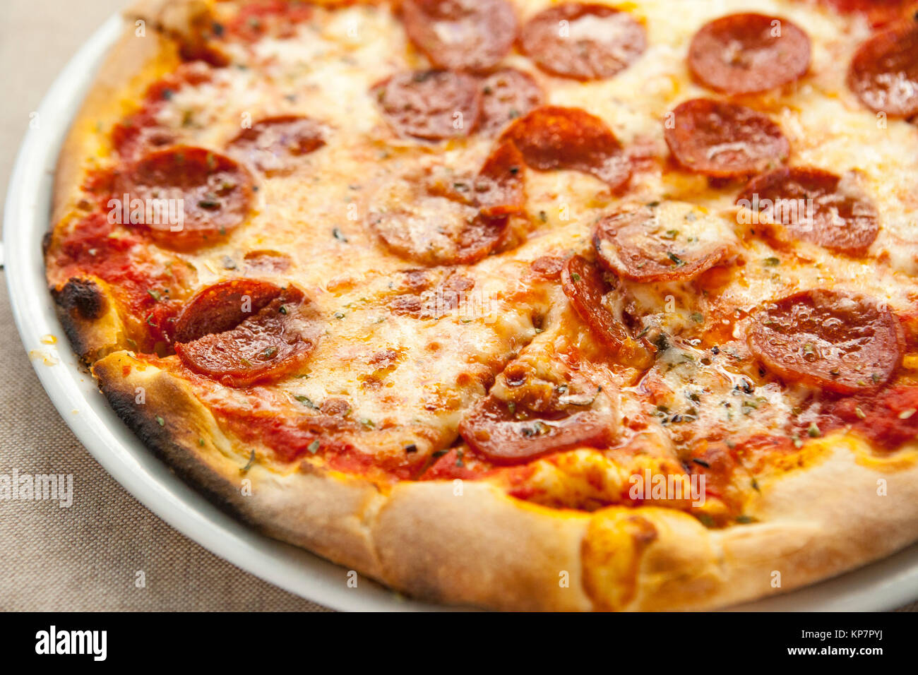 Delicious fresh pepperoni pizza on plate Stock Photo - Alamy