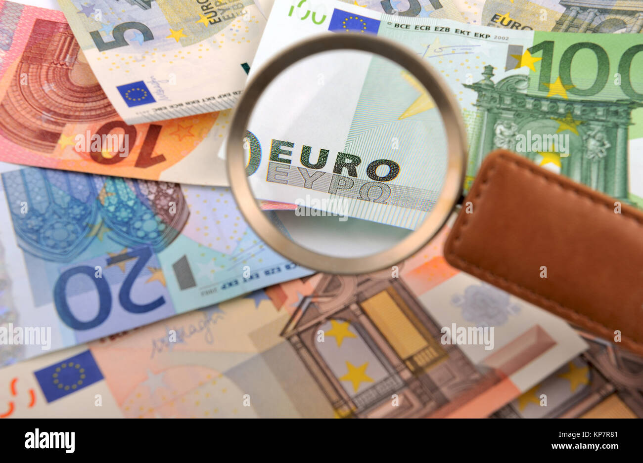 Caption EURO through a magnifying glass Stock Photo - Alamy
