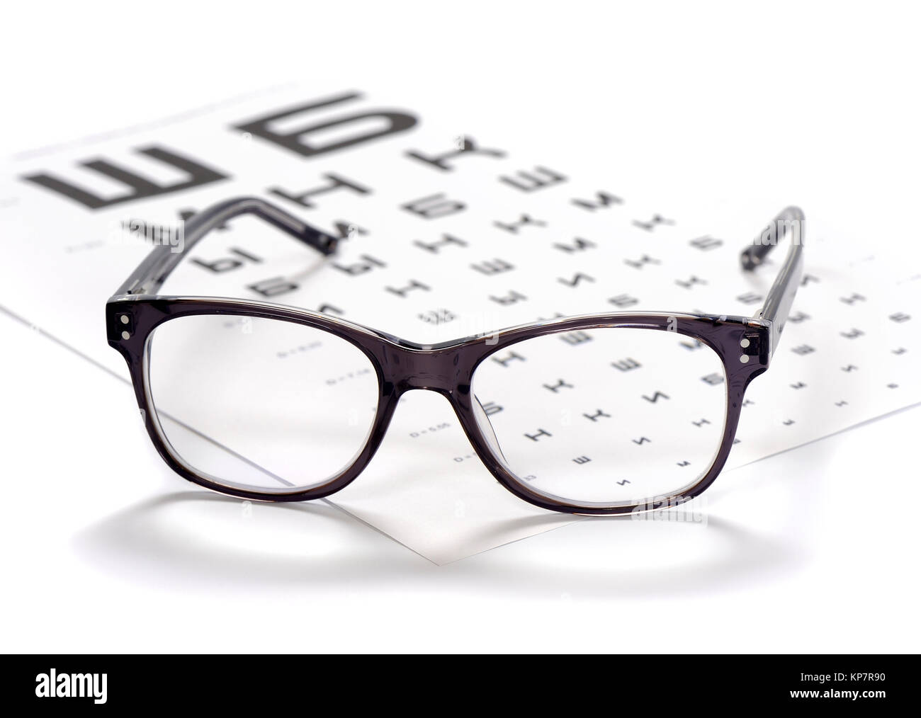 Reading eyeglasses and eye chart close-up on a light background Stock ...