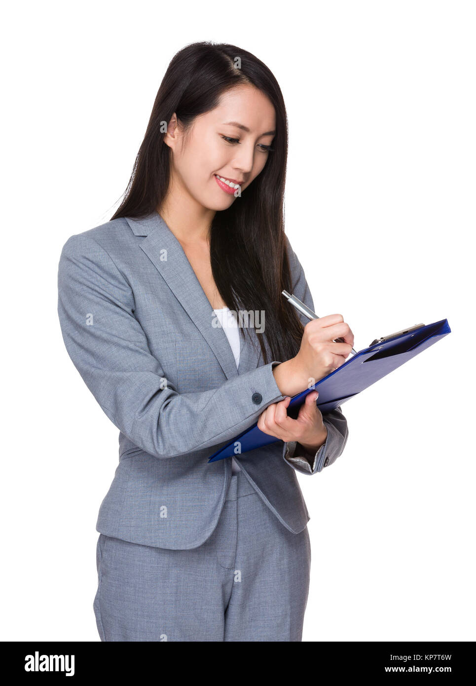Businesswoman take note on clipboard Stock Photo - Alamy