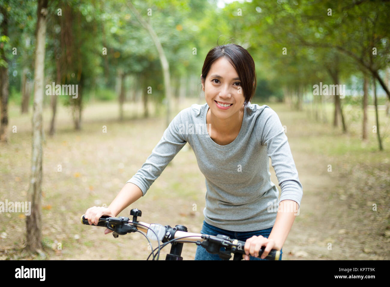 Woman enjoy cycling Stock Photo - Alamy