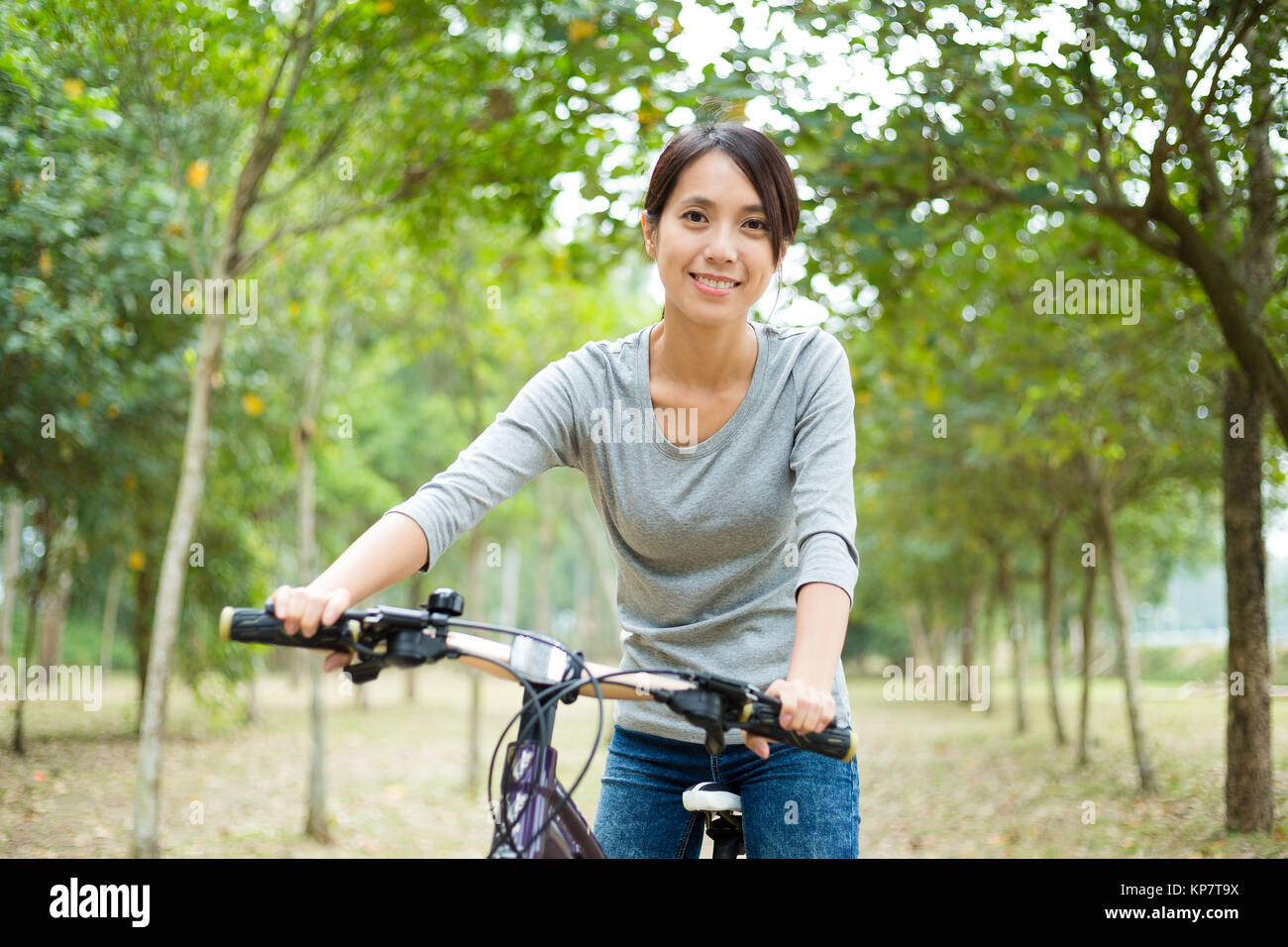 Woman go for riding bicycle Stock Photo - Alamy