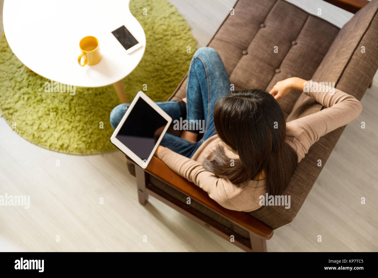 Top view of woman look at the digital tablet at home Stock Photo - Alamy