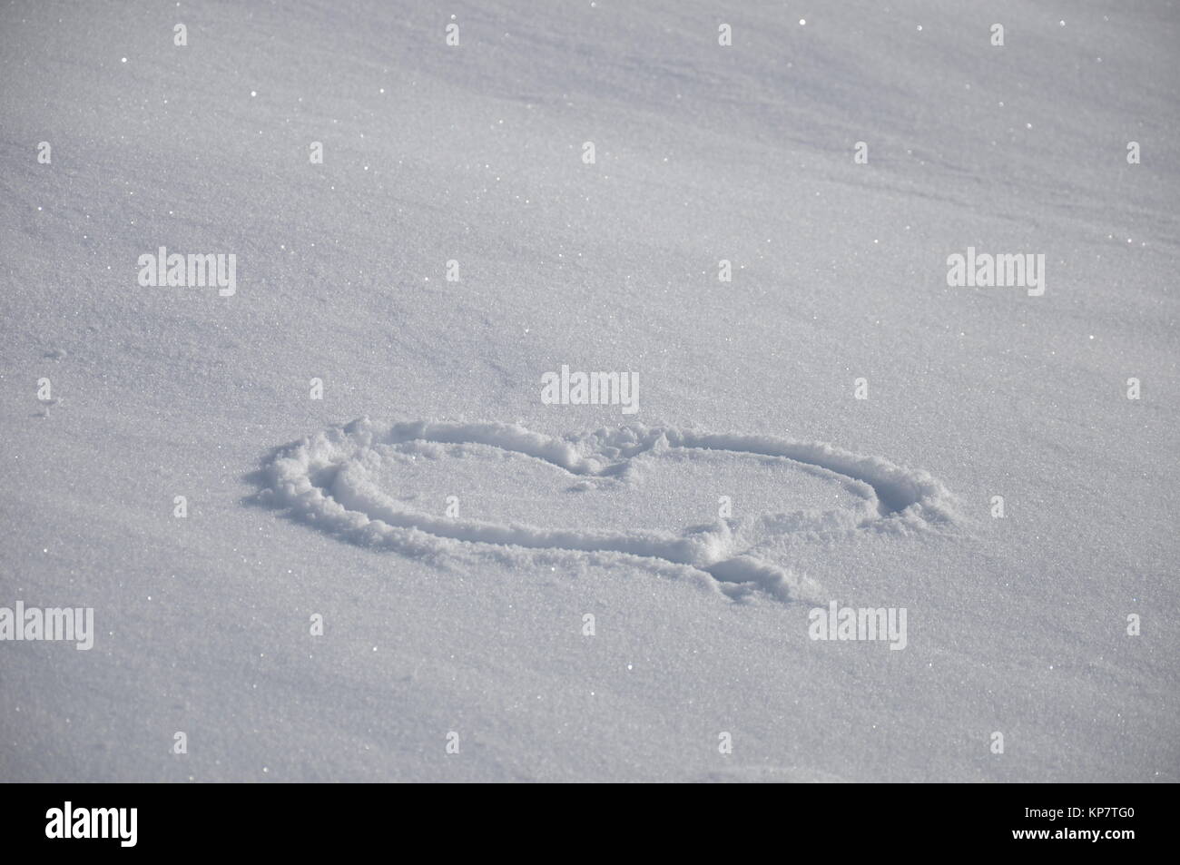 Heart in the snow Stock Photo - Alamy