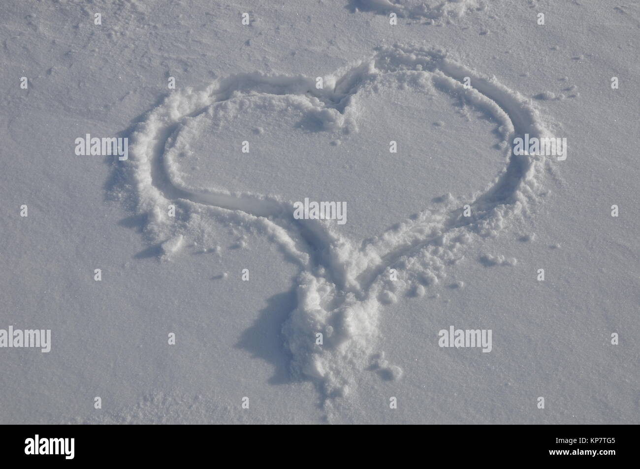 Heart in the snow Stock Photo - Alamy