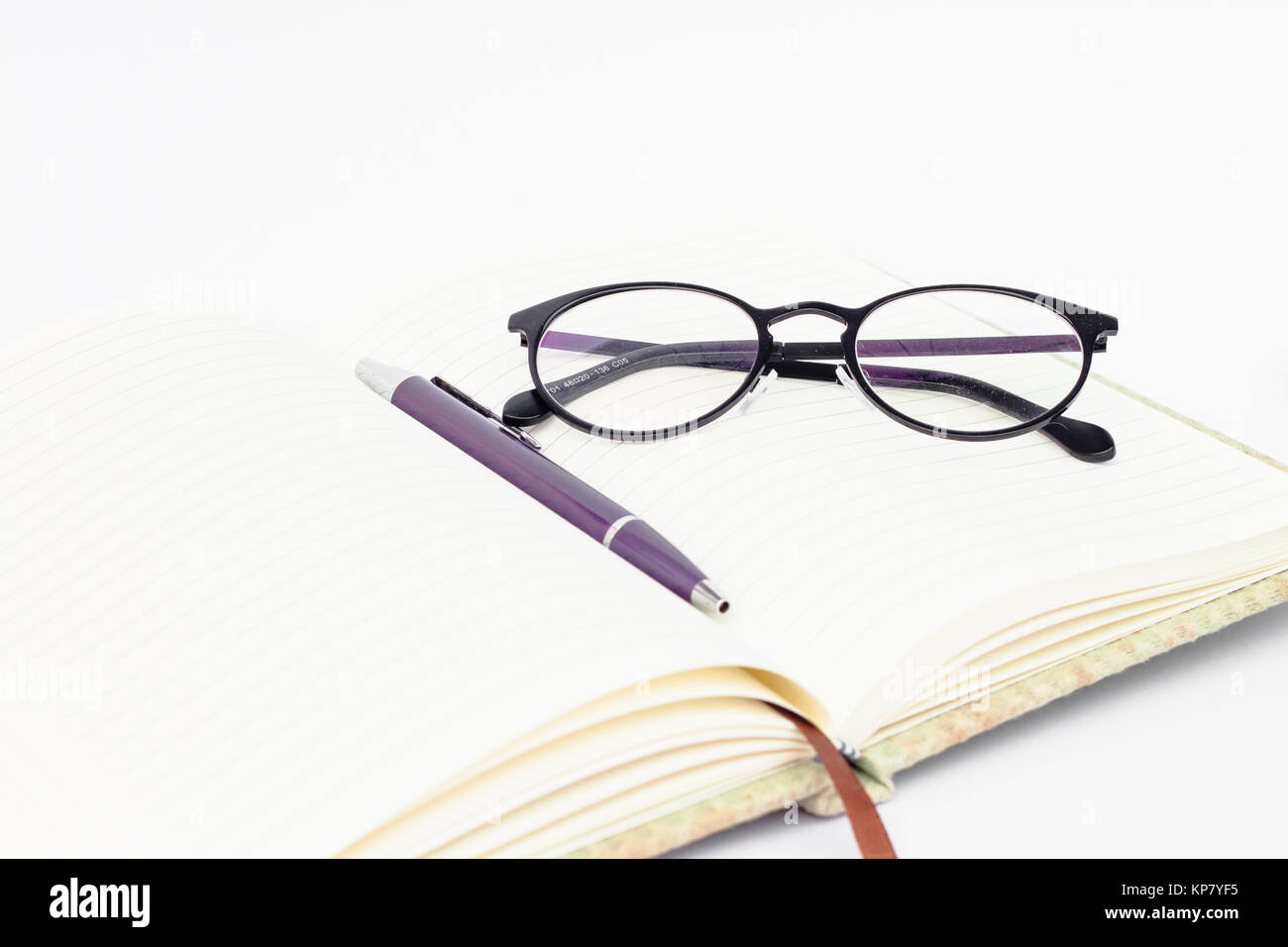 Notebook with pen isolated on white background Stock Photo - Alamy
