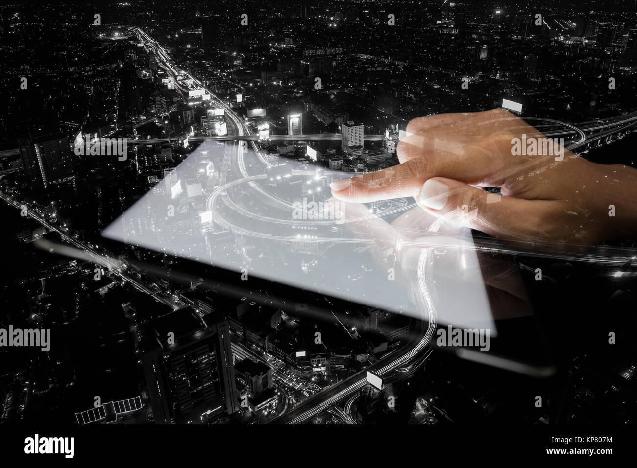 double exposure hand using tablet and city on night background Stock ...