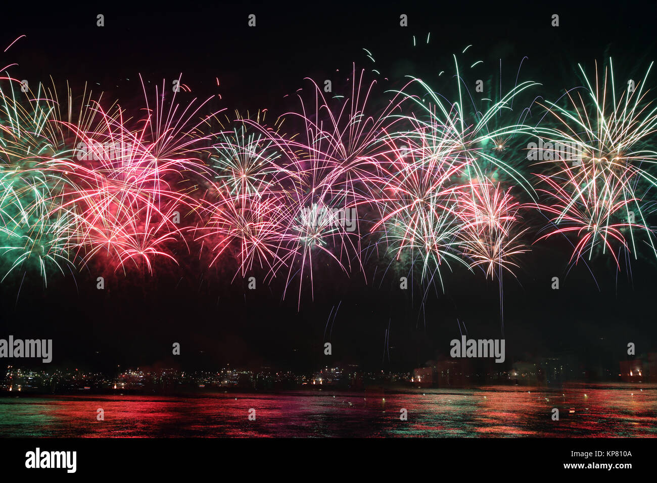 colorful fireworks reflect on sea water Stock Photo - Alamy
