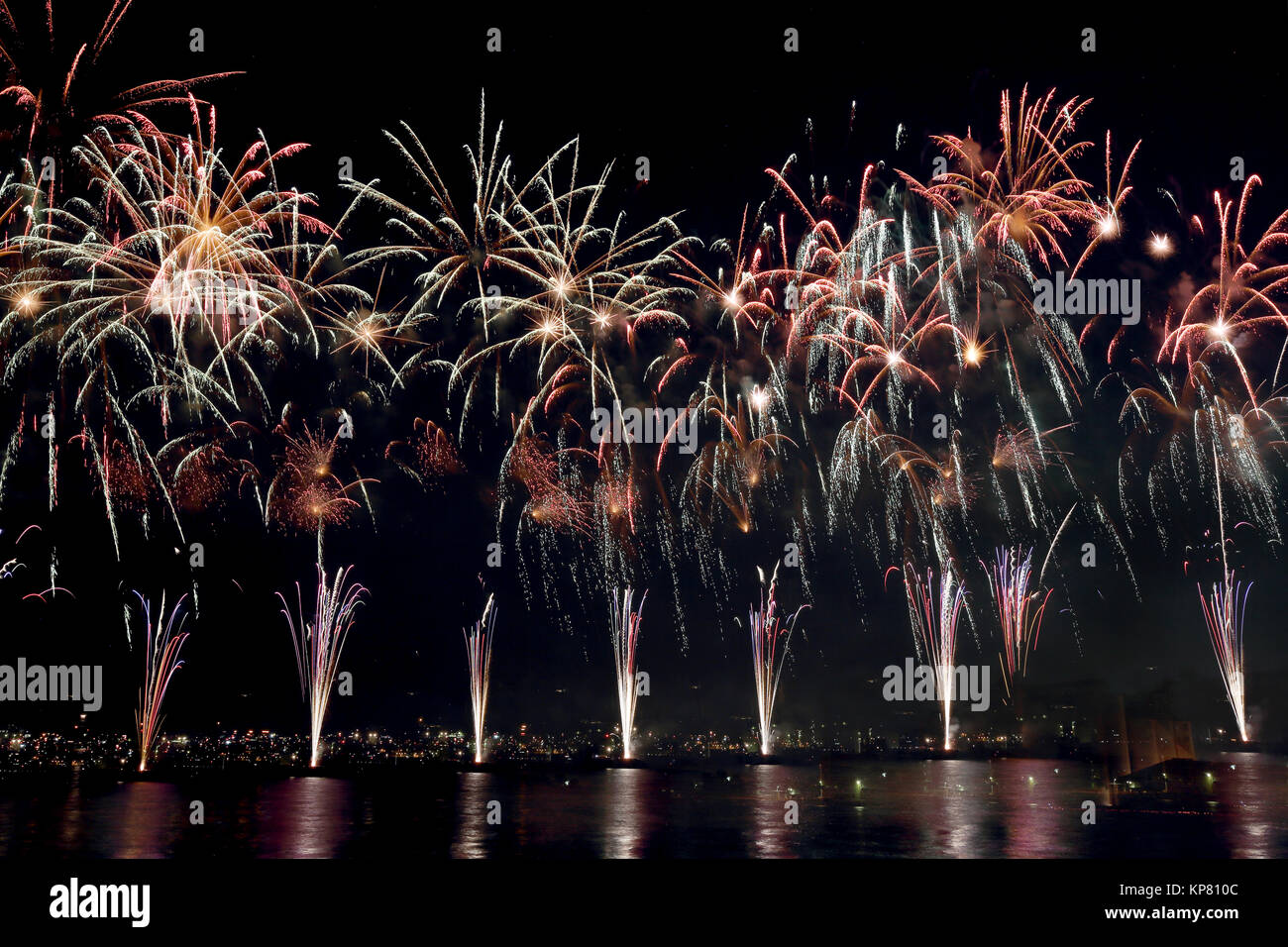 colorful fireworks reflect on sea water Stock Photo - Alamy