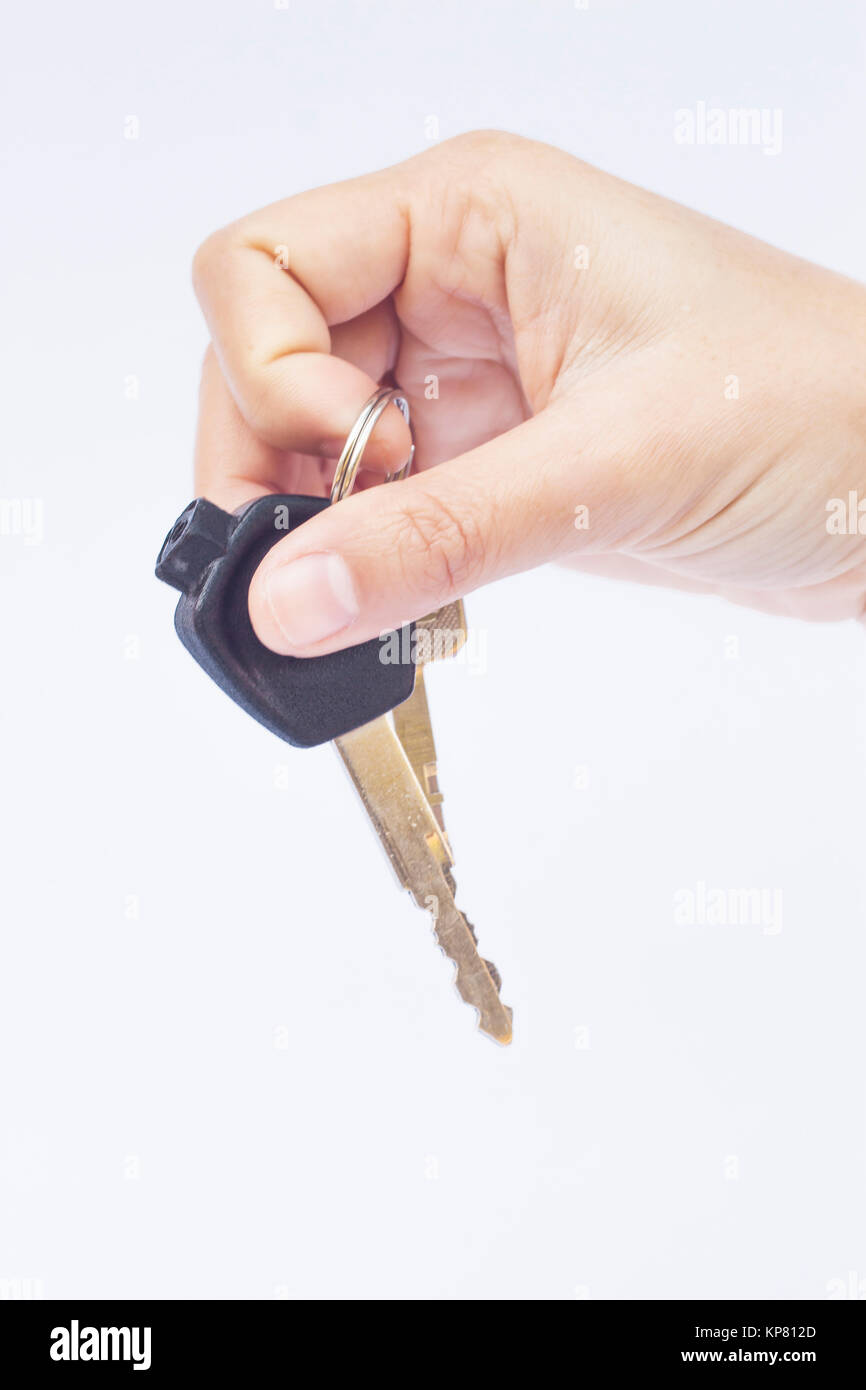 Hand with a car key isolated on white background Stock Photo - Alamy