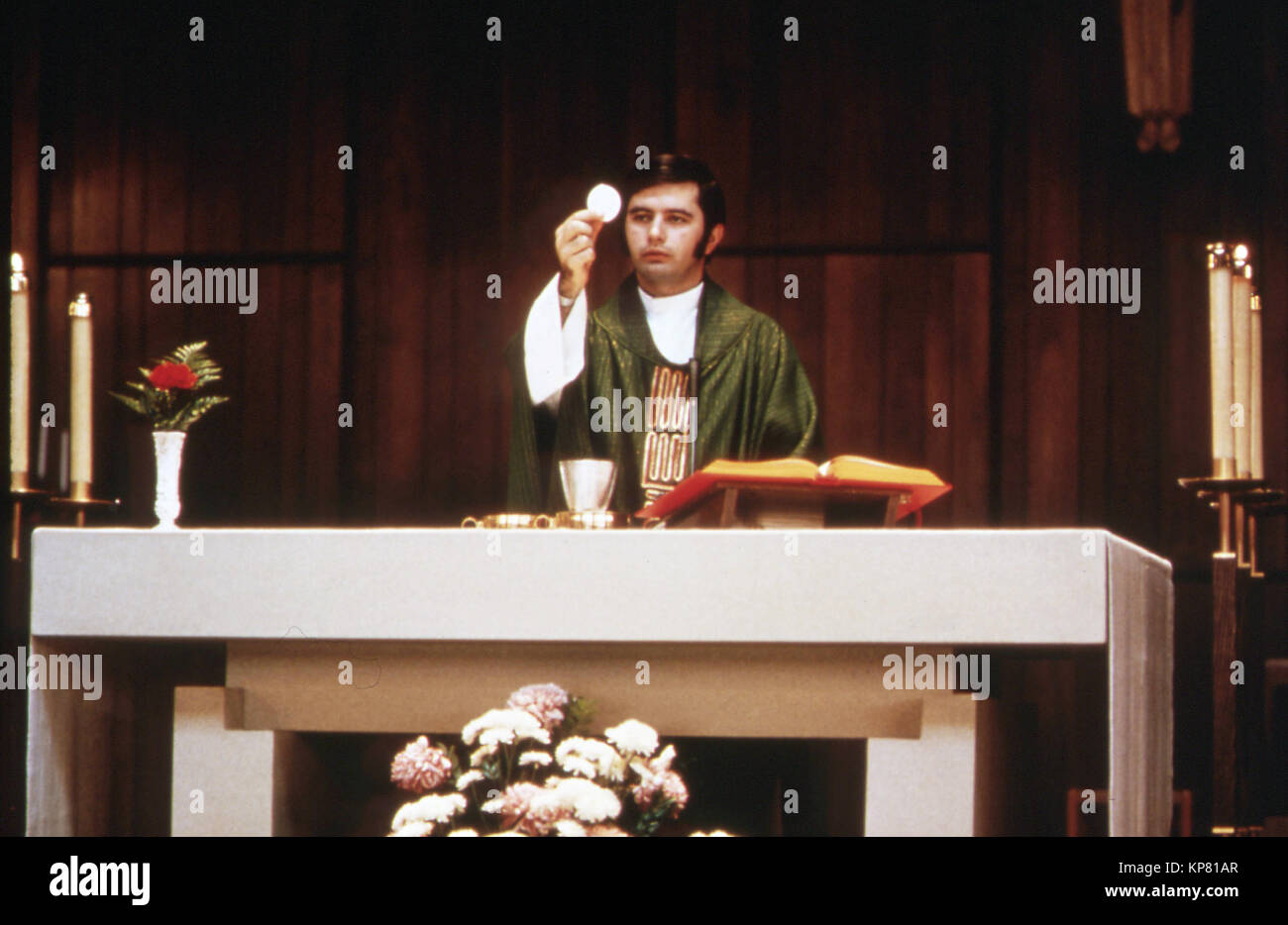 Catholic priest offers host hi-res stock photography and images - Alamy