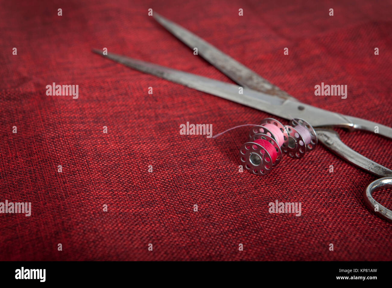 red fabric scissors Stock Photo - Alamy