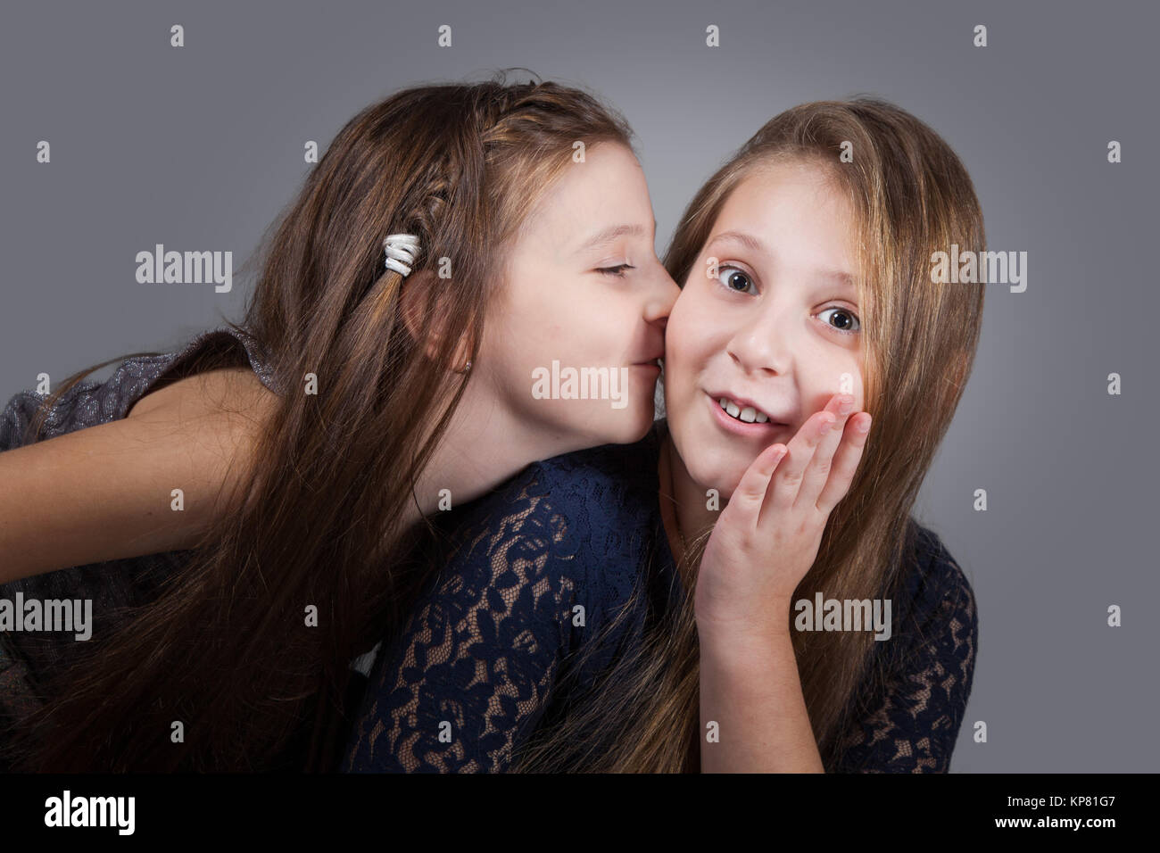 Sister portraits, studio Stock Photo - Alamy