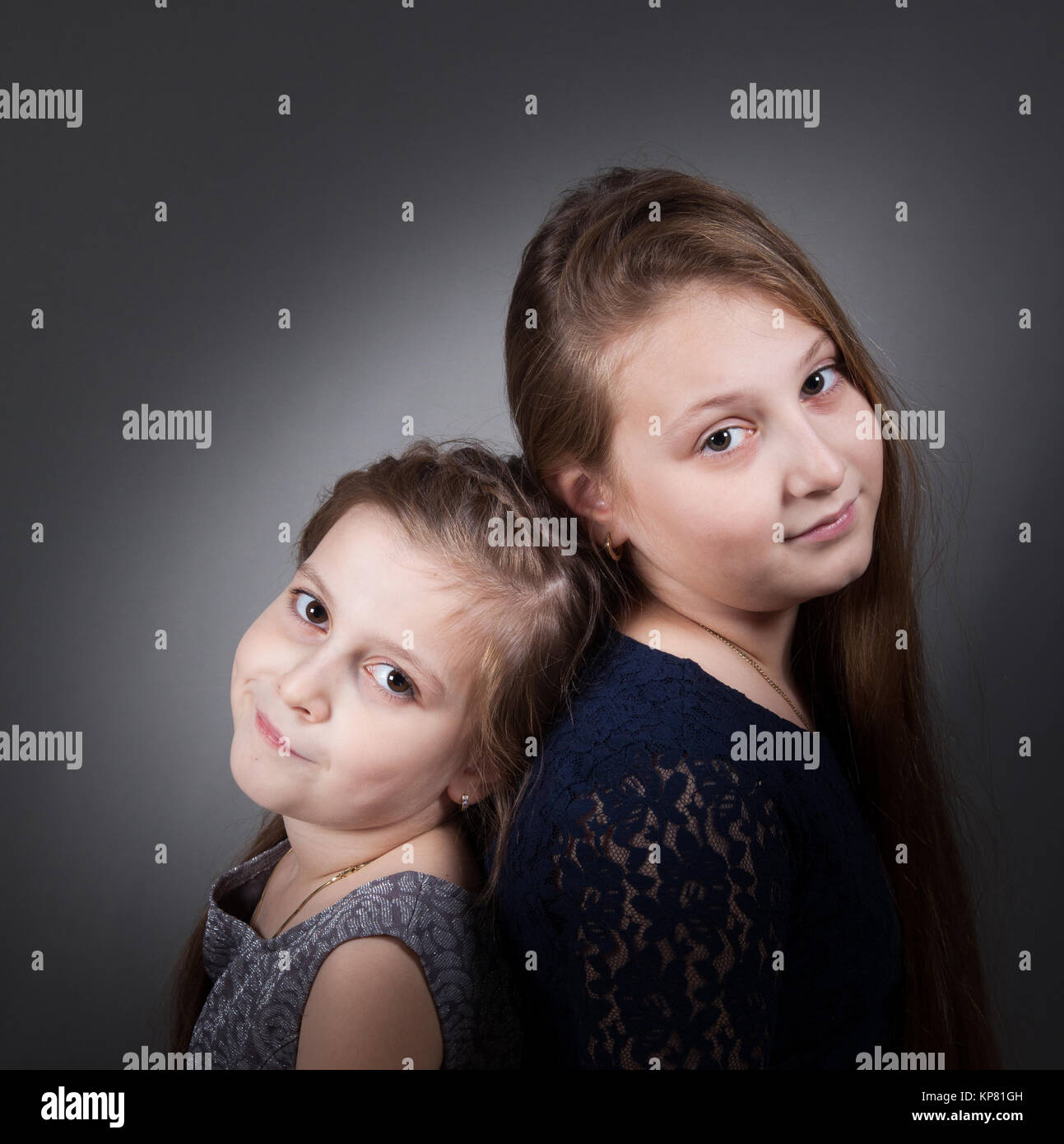 Sister portraits, studio Stock Photo - Alamy