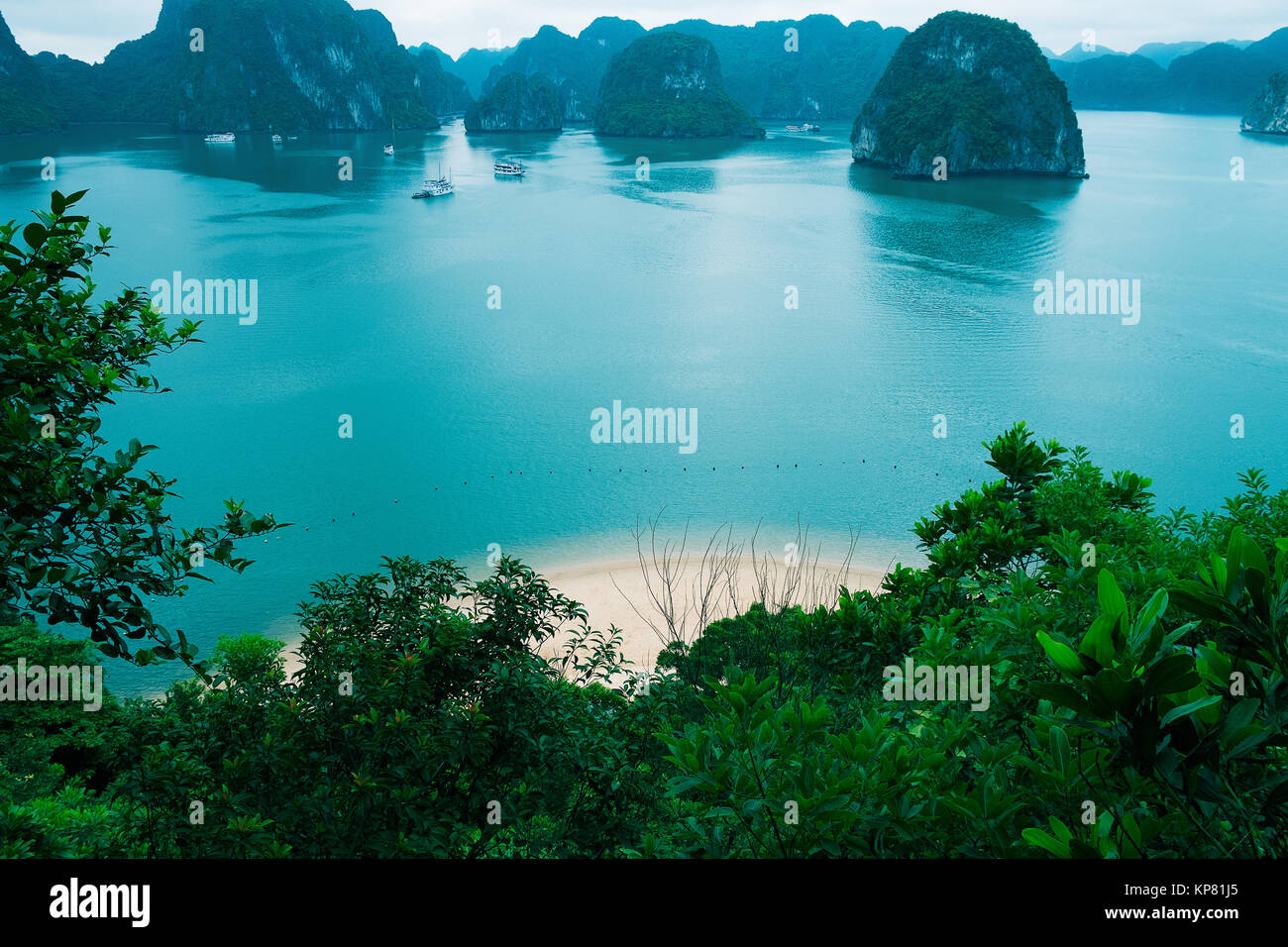 Islands and beach in Halong Bay Stock Photo - Alamy