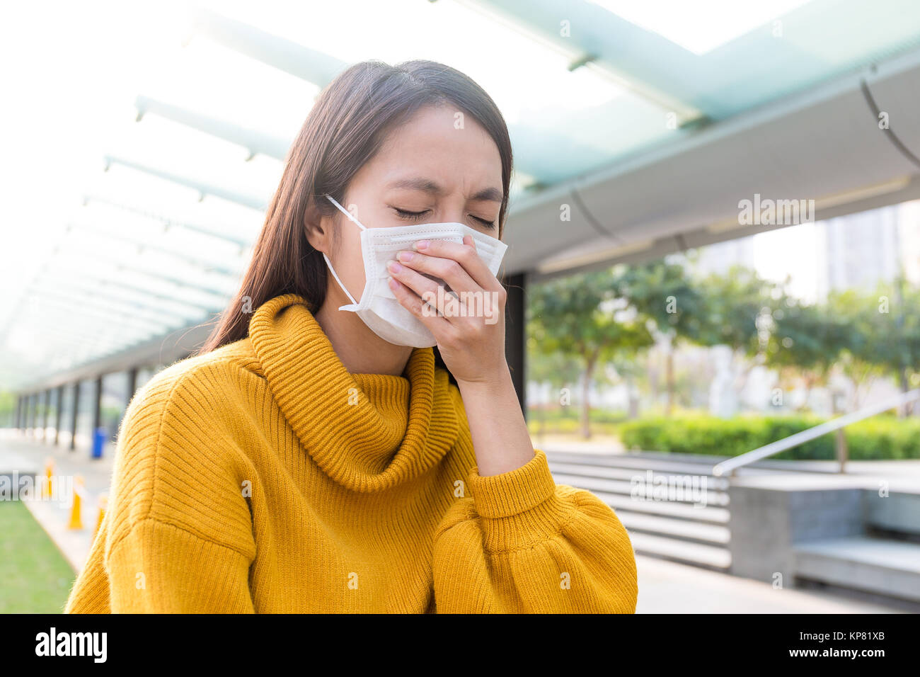 Asian woman wearing face mask Stock Photo - Alamy