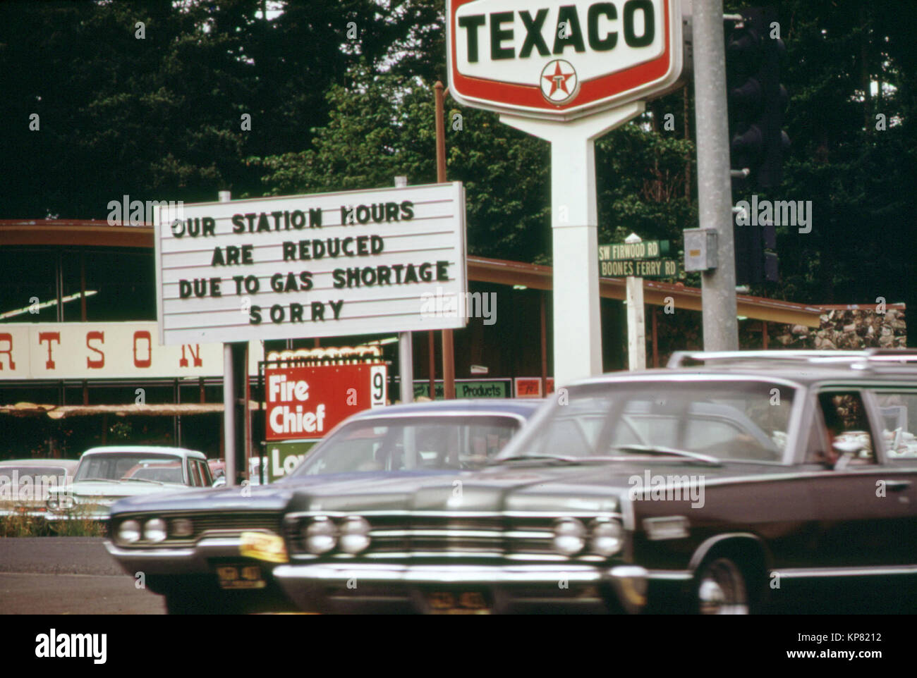Cars drive in front of a Texaco statioin in 1970s Portland, Oregon ...
