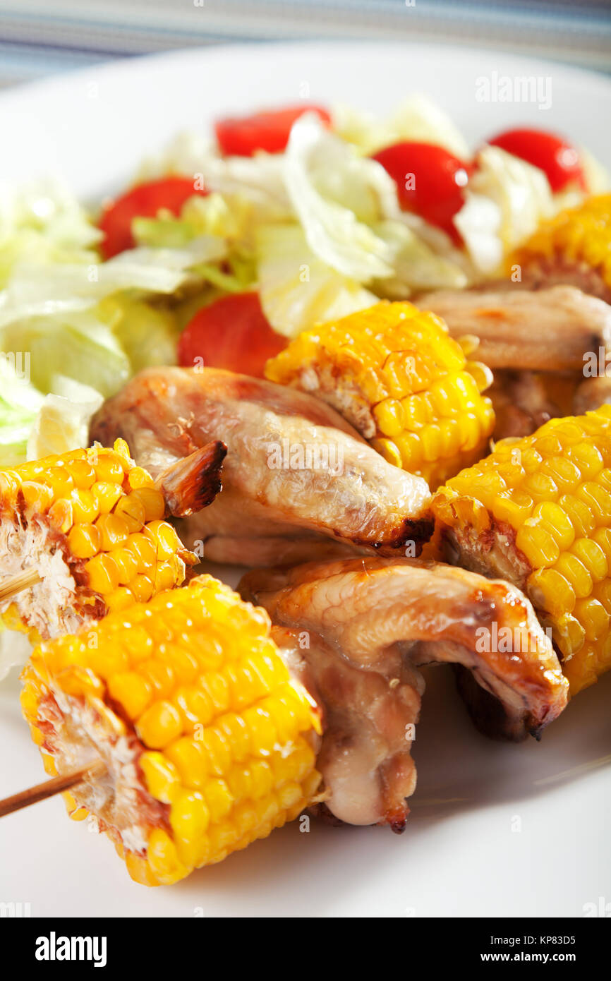 Chicken wings with corn skewers,Chicken wings with corn skewers Stock ...