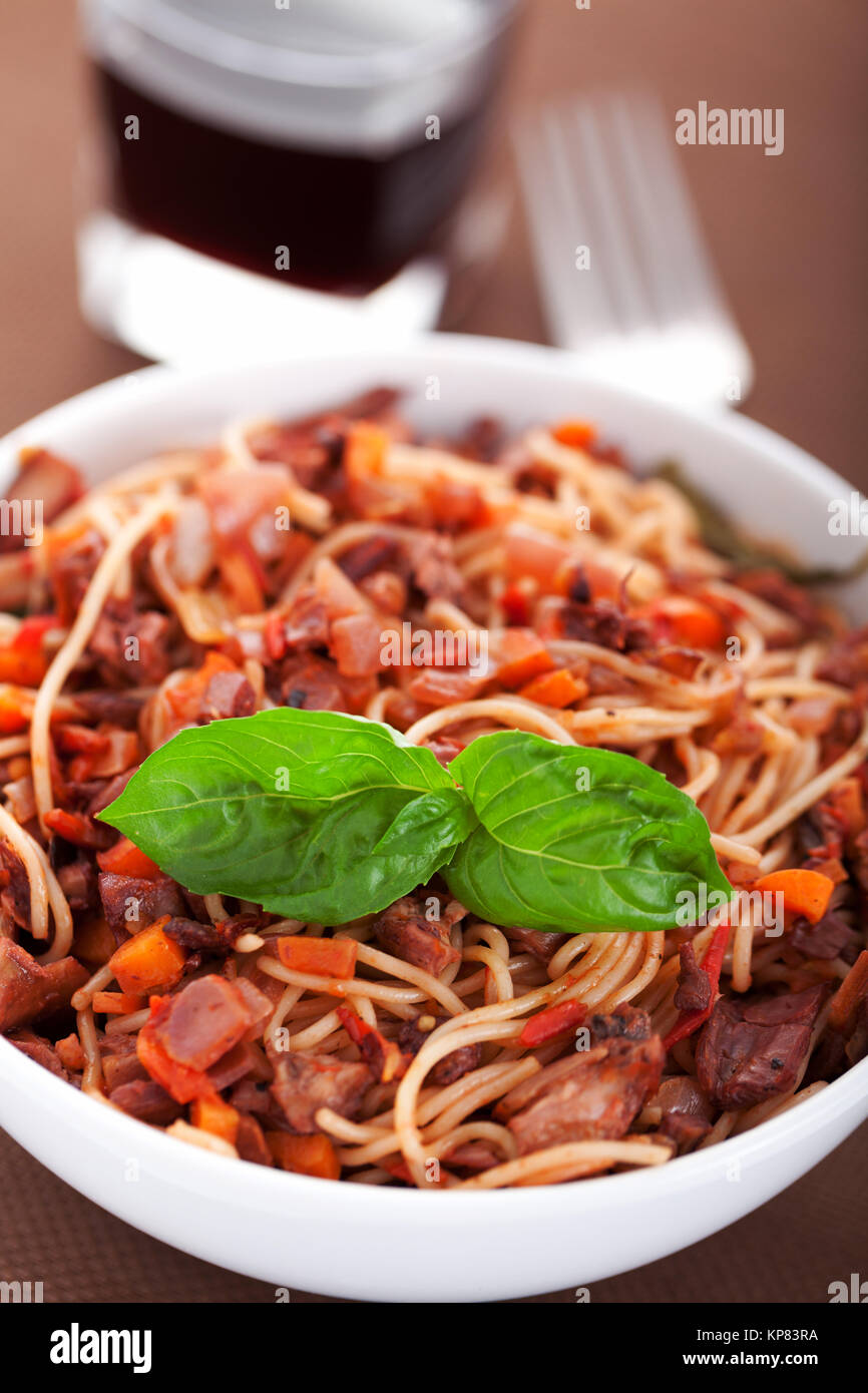 Spaghetti with rabbit and tomatos Stock Photo - Alamy