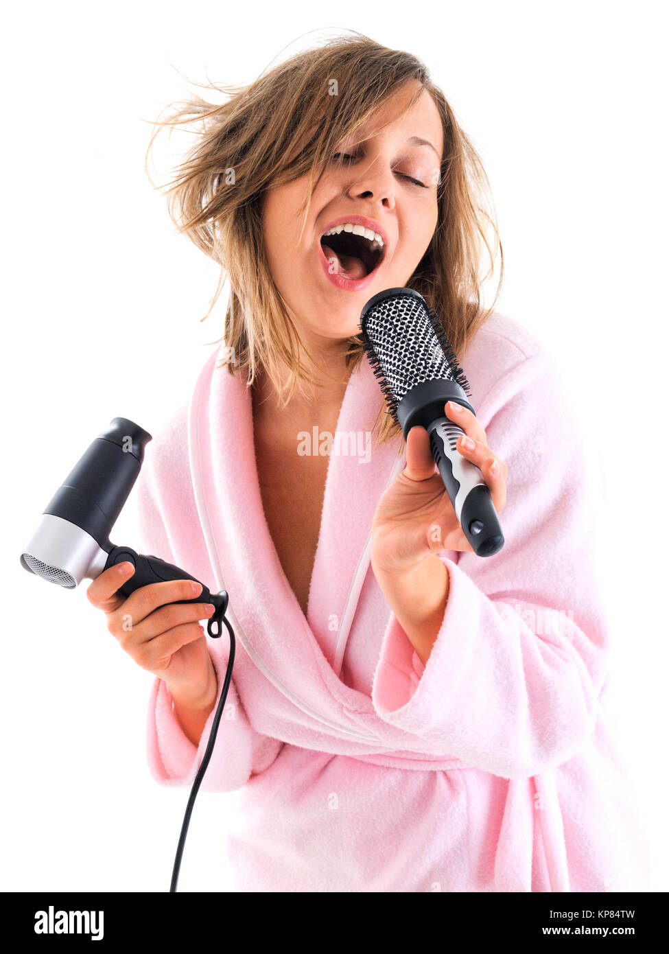 Woman singing with hairbrush Stock Photo - Alamy