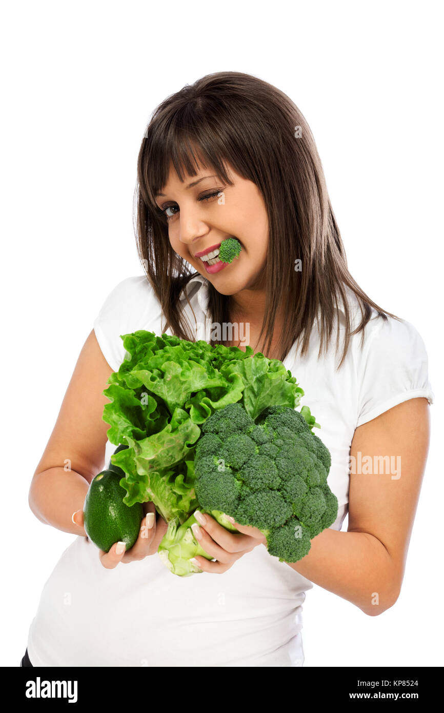Young woman eating broccoli Stock Photo - Alamy