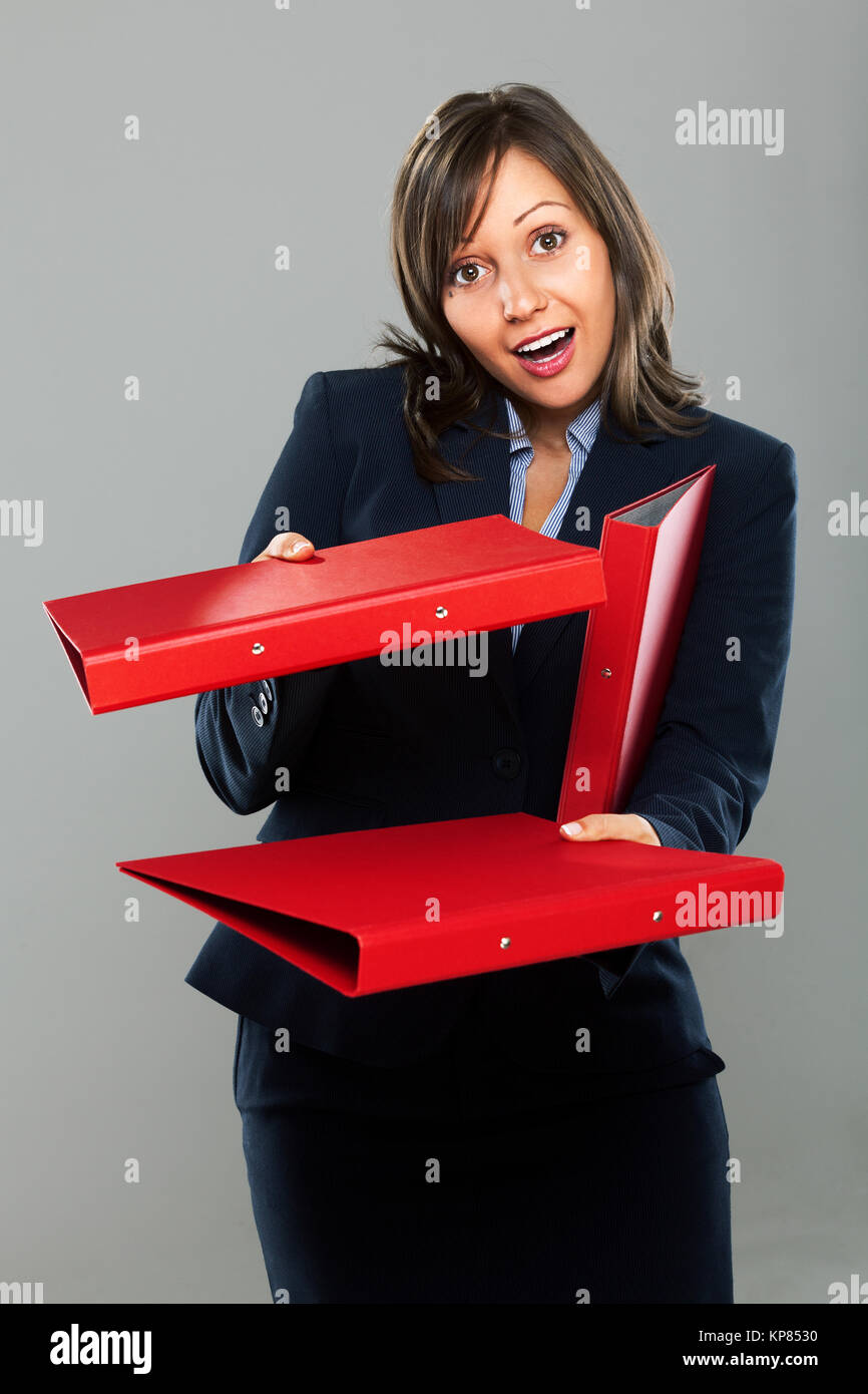 Businesswoman giving folders Stock Photo - Alamy