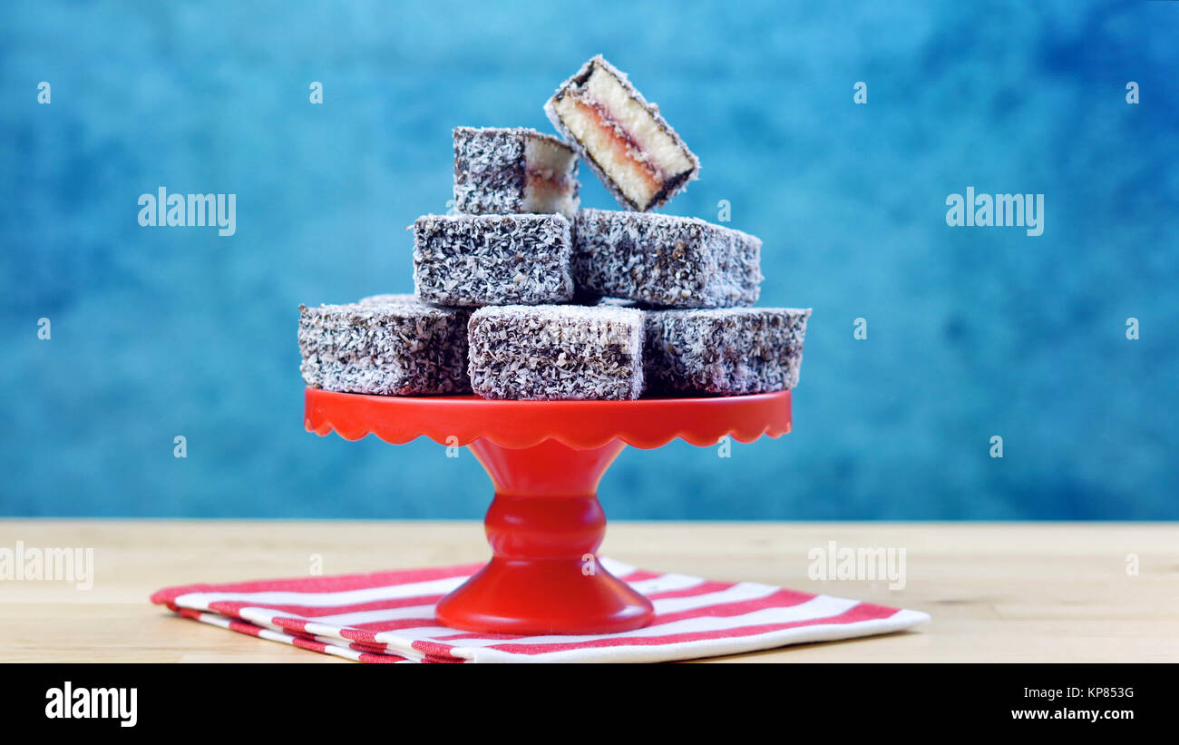Iconic traditional Australian party food, Lamington cake, on a red ...