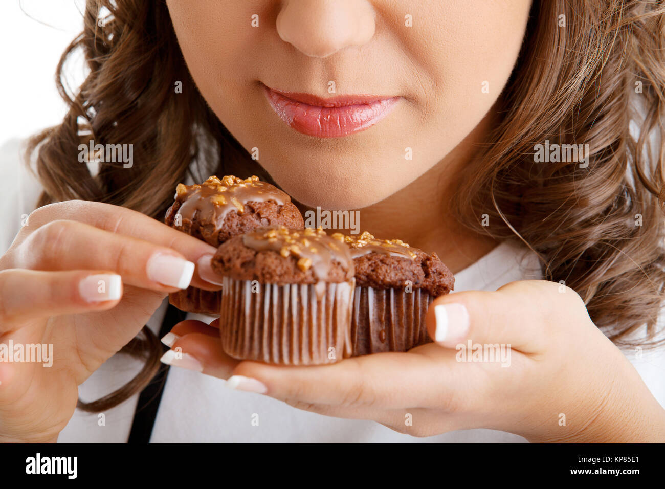 Beautiful young woman eats chocolate hi-res stock photography and ...