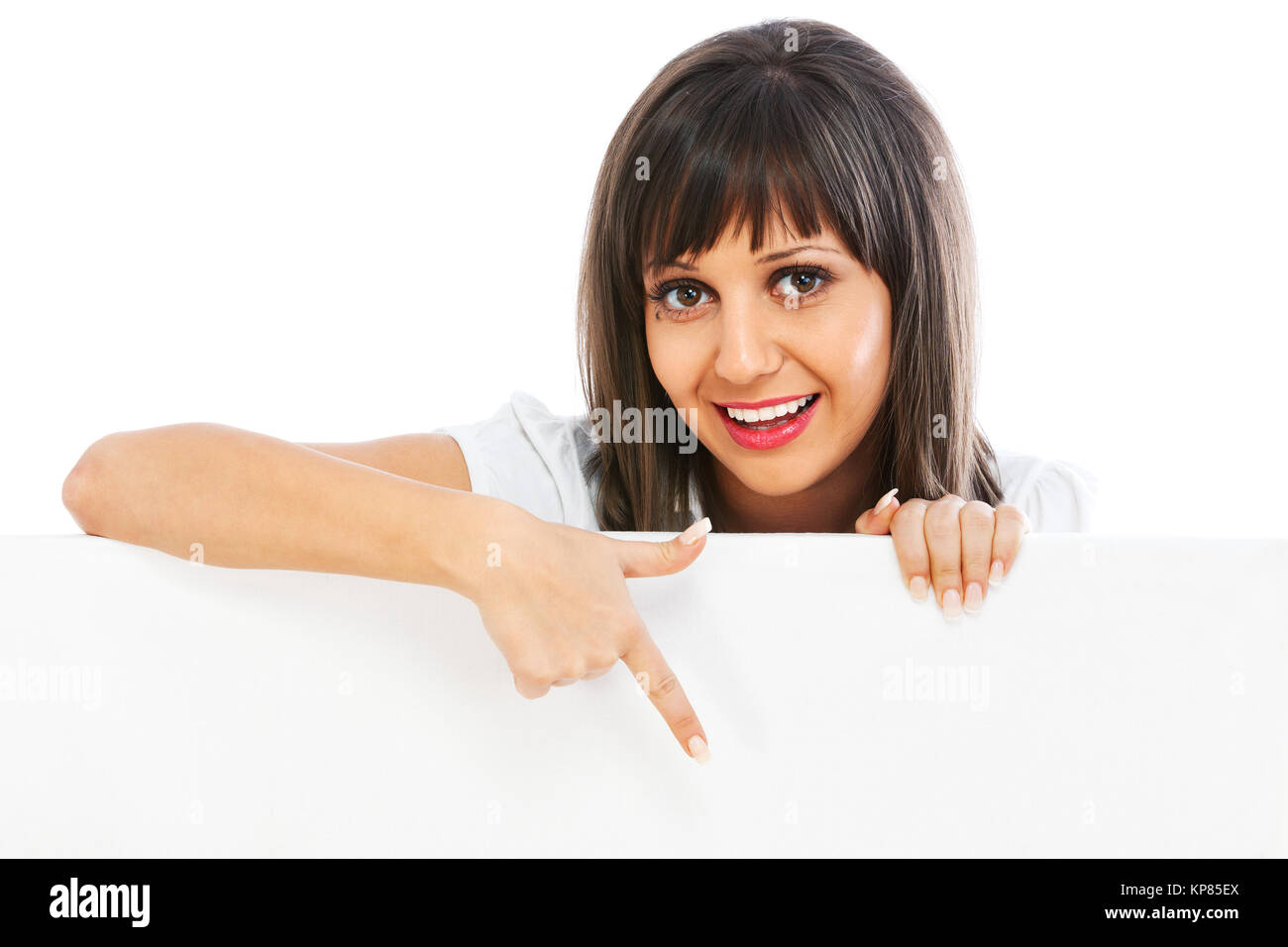 Young woman pointing behind billboard,Young woman pointing behind ...