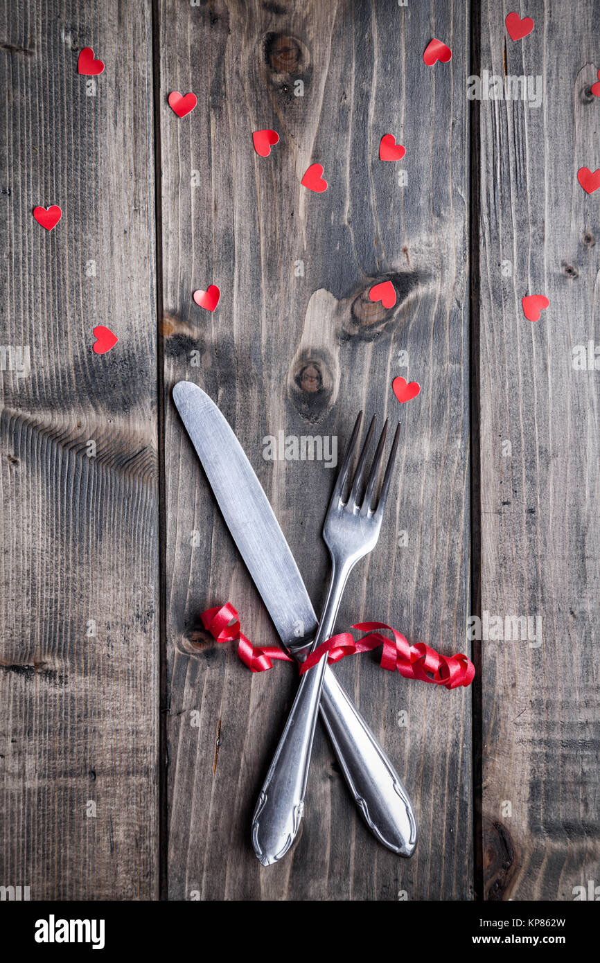 Romantic dinner set on wooden background Stock Photo - Alamy