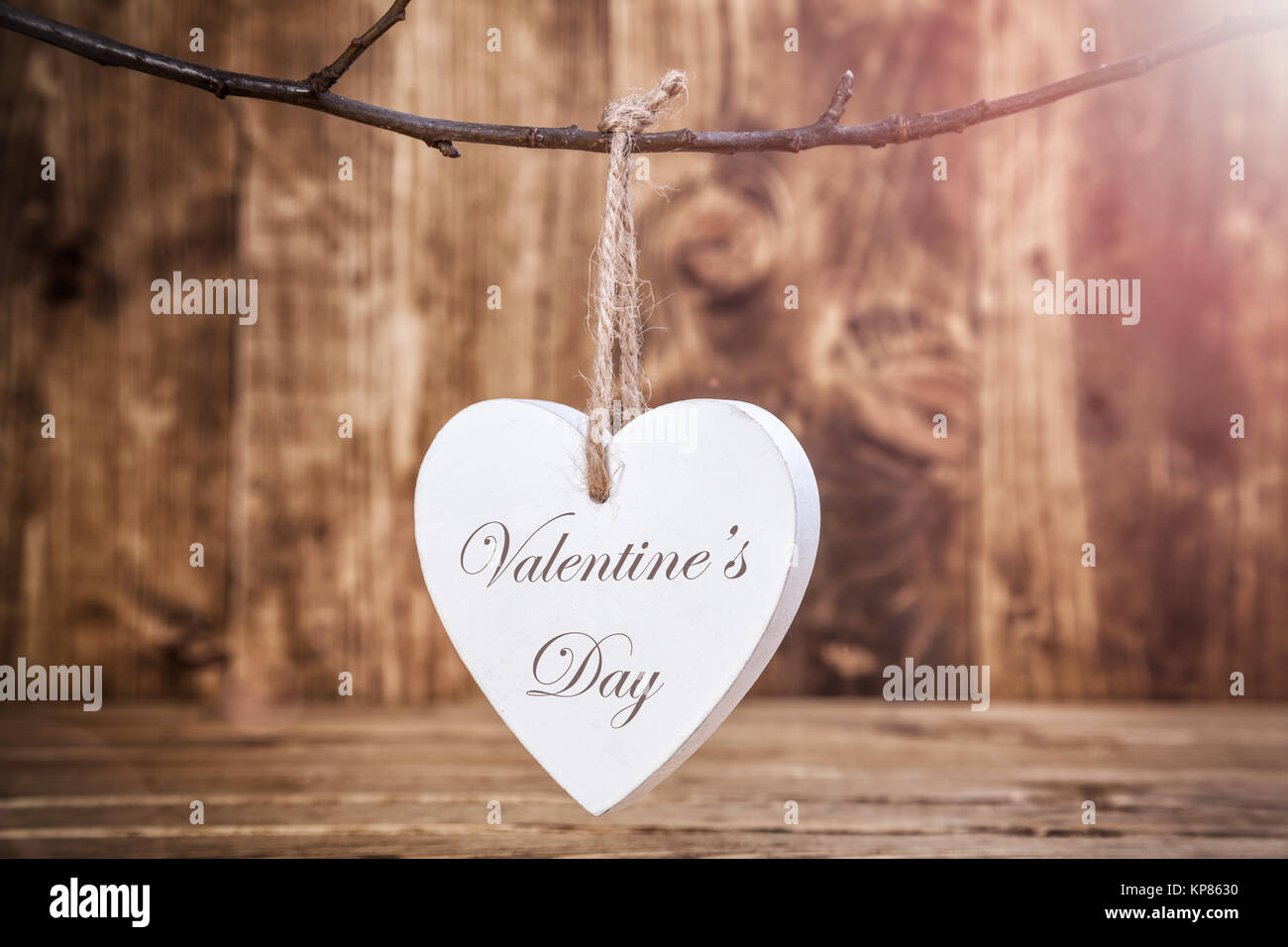 Love concept. Heart hanging on a string Stock Photo - Alamy