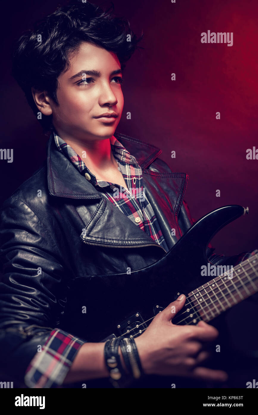 Portrait handsome lad playing guitar hi-res stock photography and ...
