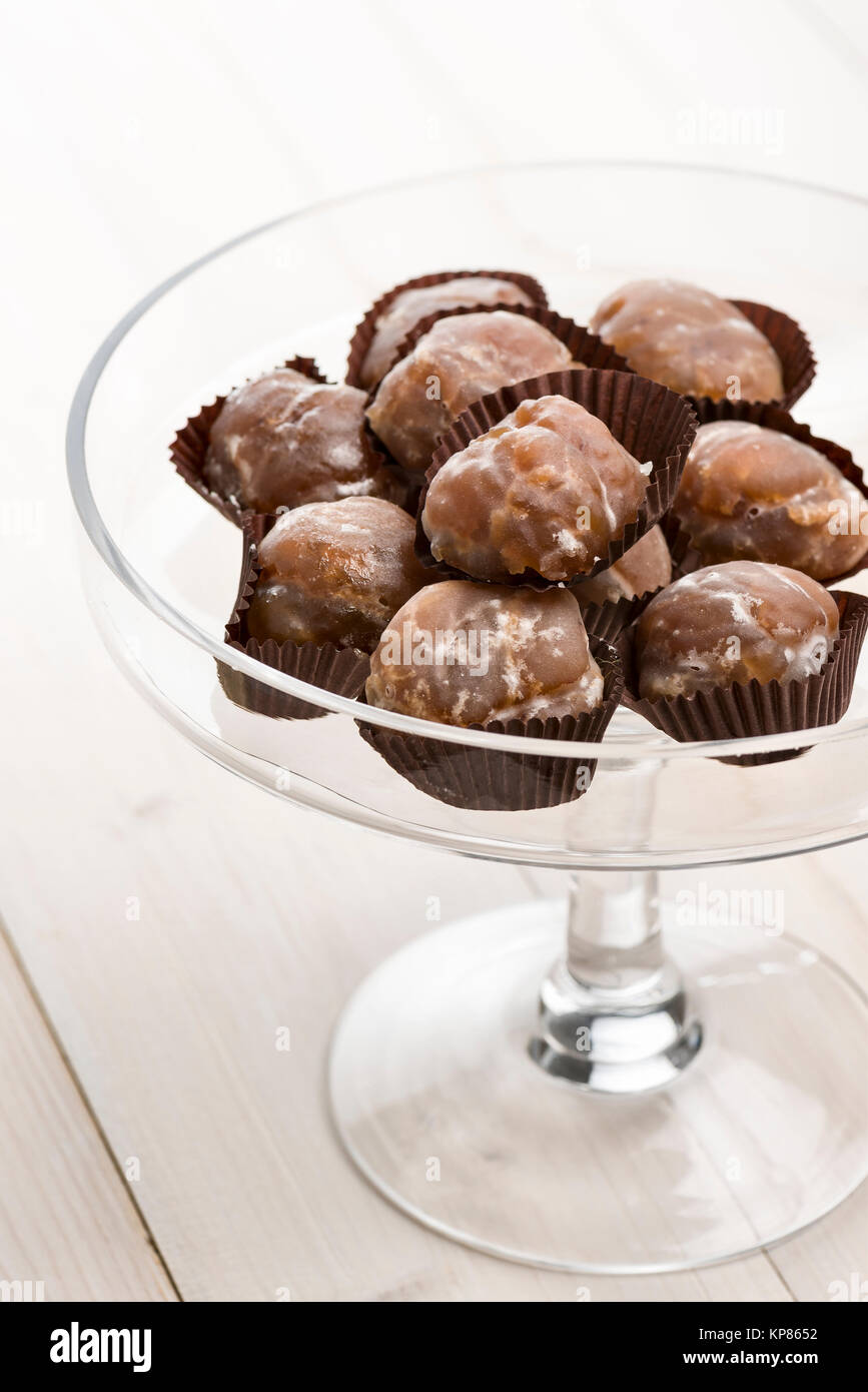 marron glace on glass tray on white table Stock Photo - Alamy