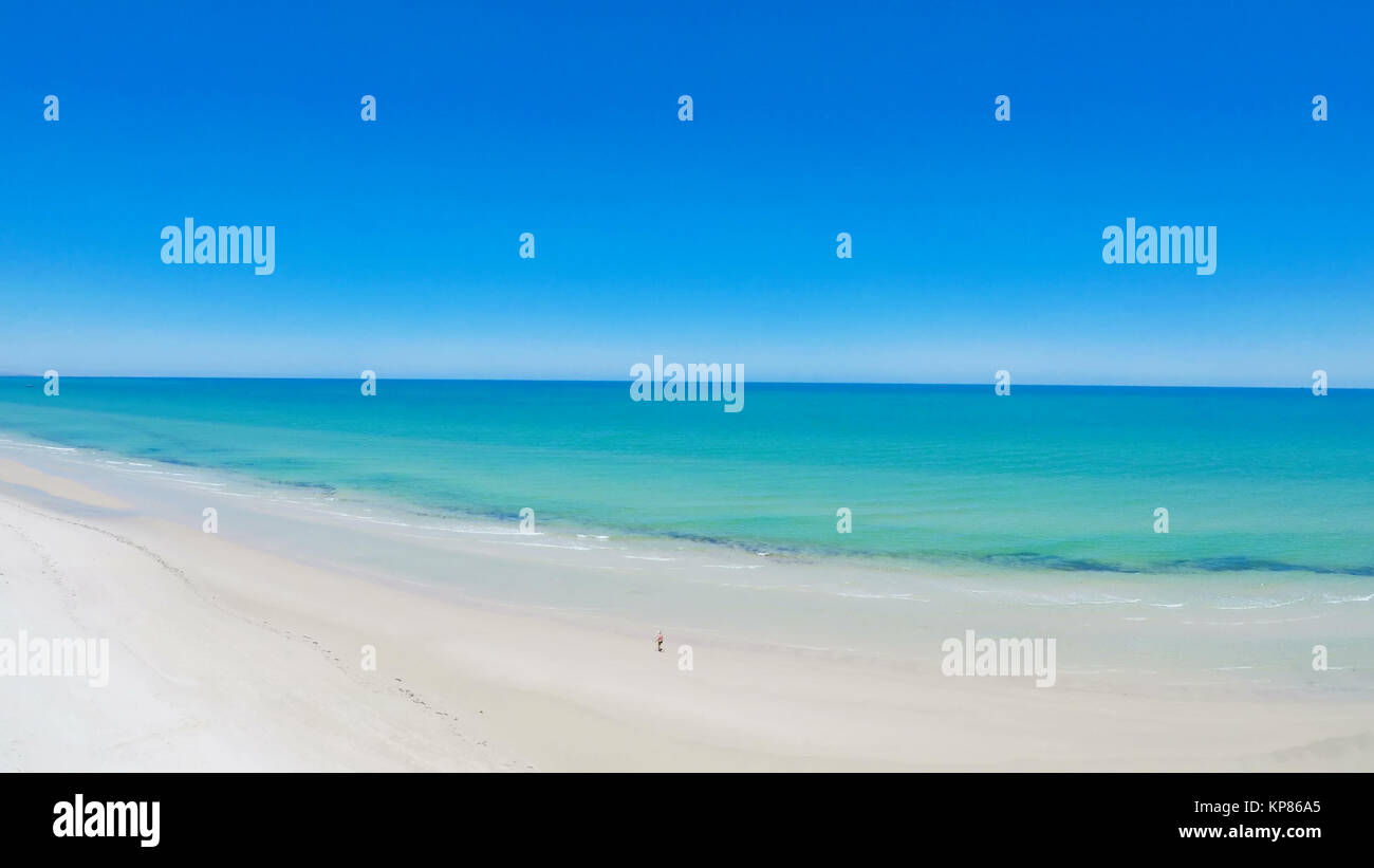 Drone aerial view of wide open white sandy beach, taken at Tennyson ...