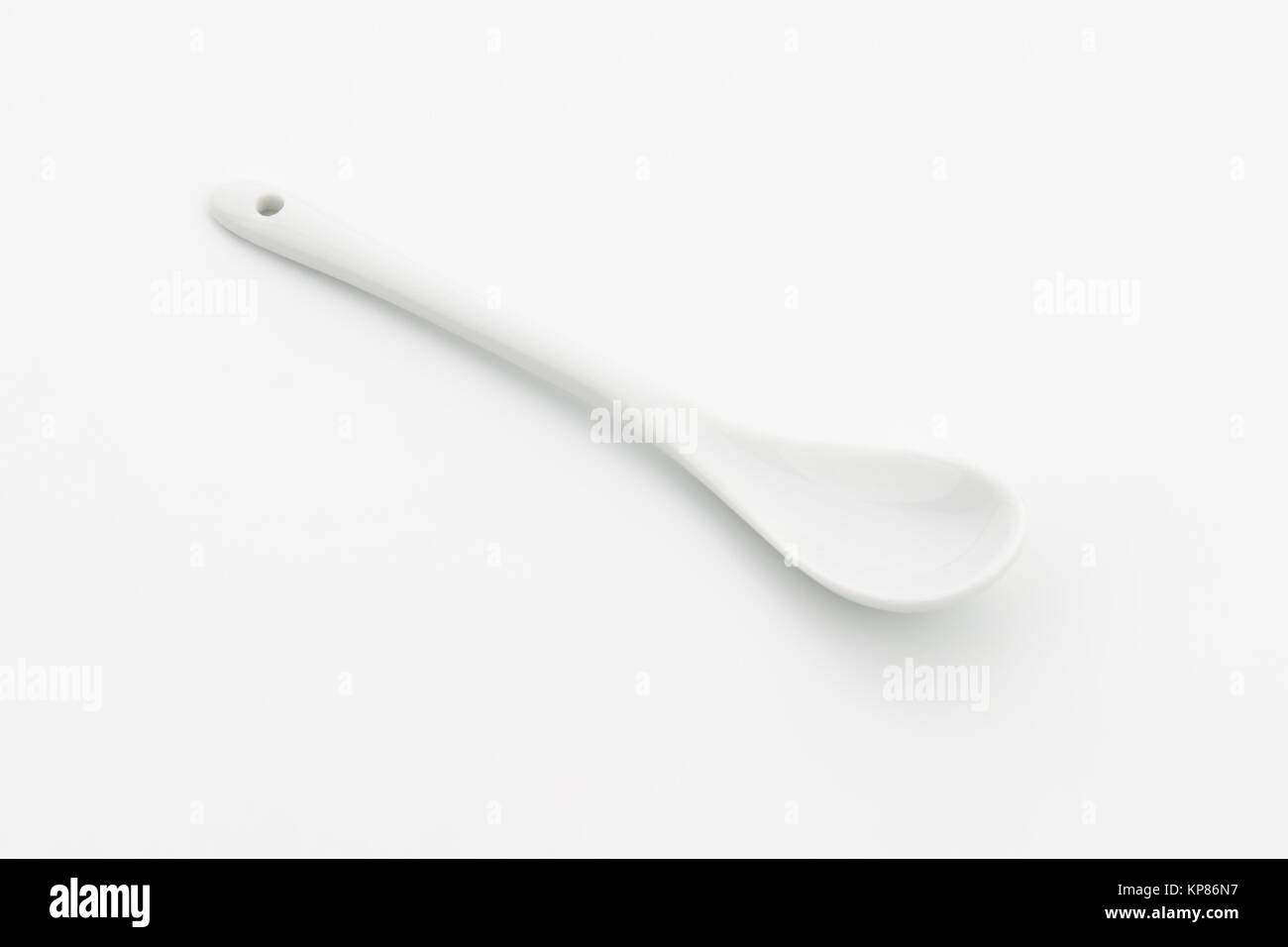 White porcelain spoon Stock Photo - Alamy