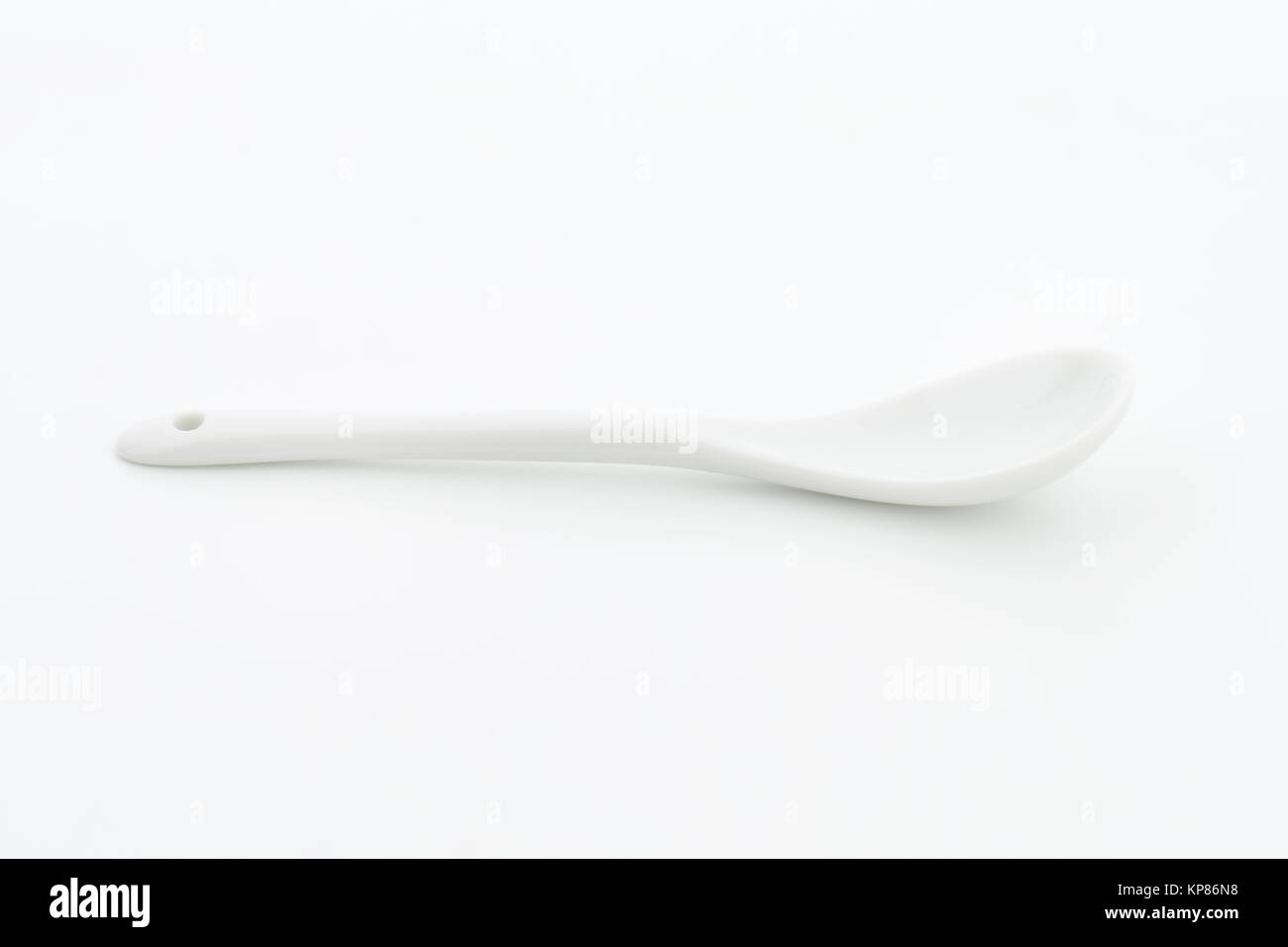 White porcelain spoon Stock Photo - Alamy