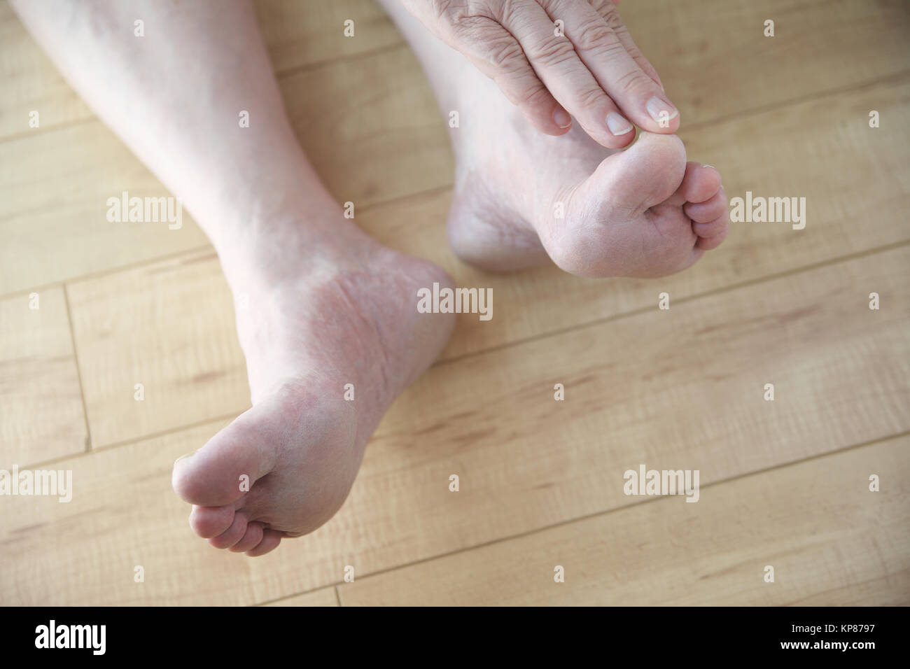 Older man stretches to touch his toe Stock Photo - Alamy