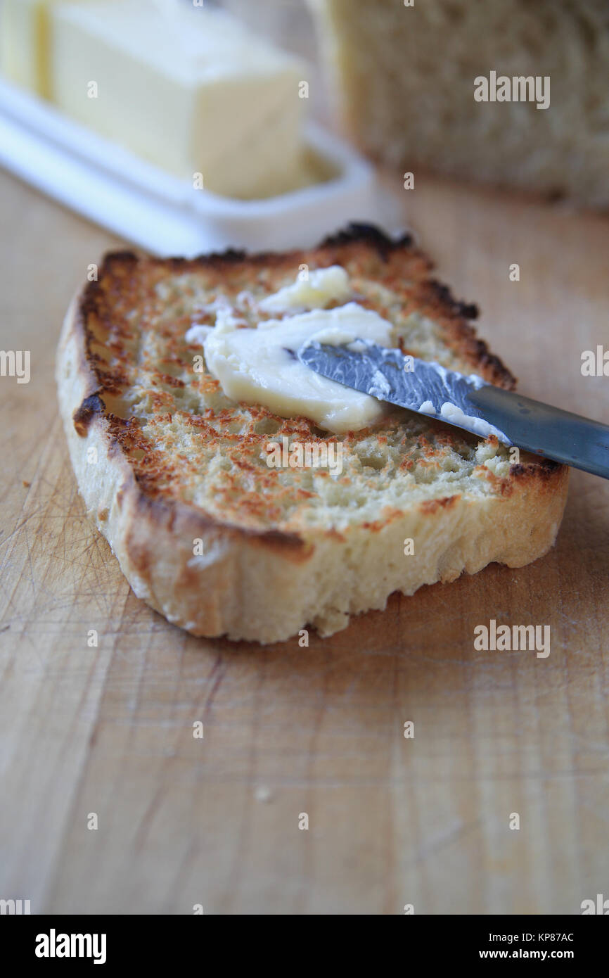 Slice of toast with butter Stock Photo - Alamy