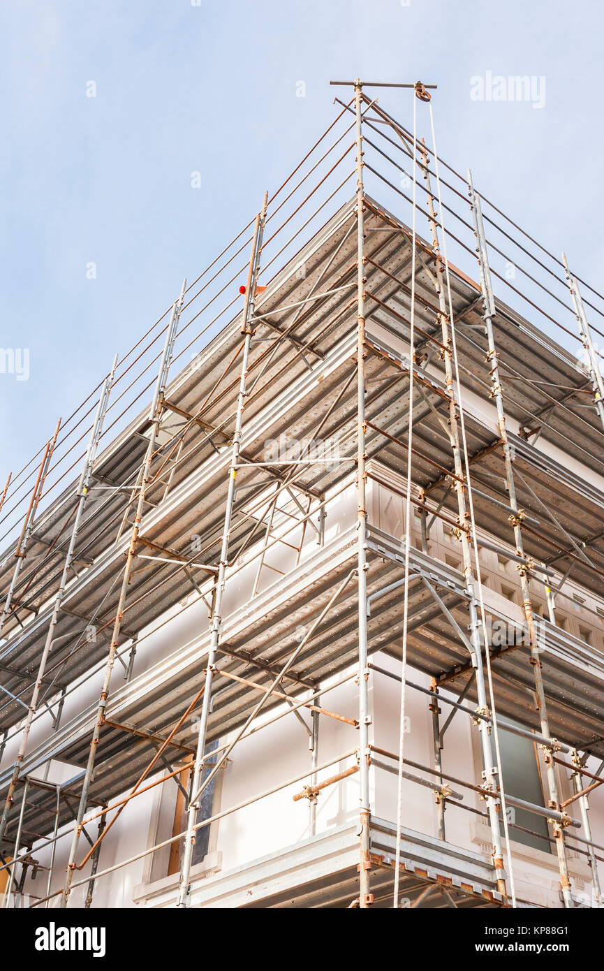 House for renovation with the scaffolding for bricklayers Stock Photo ...
