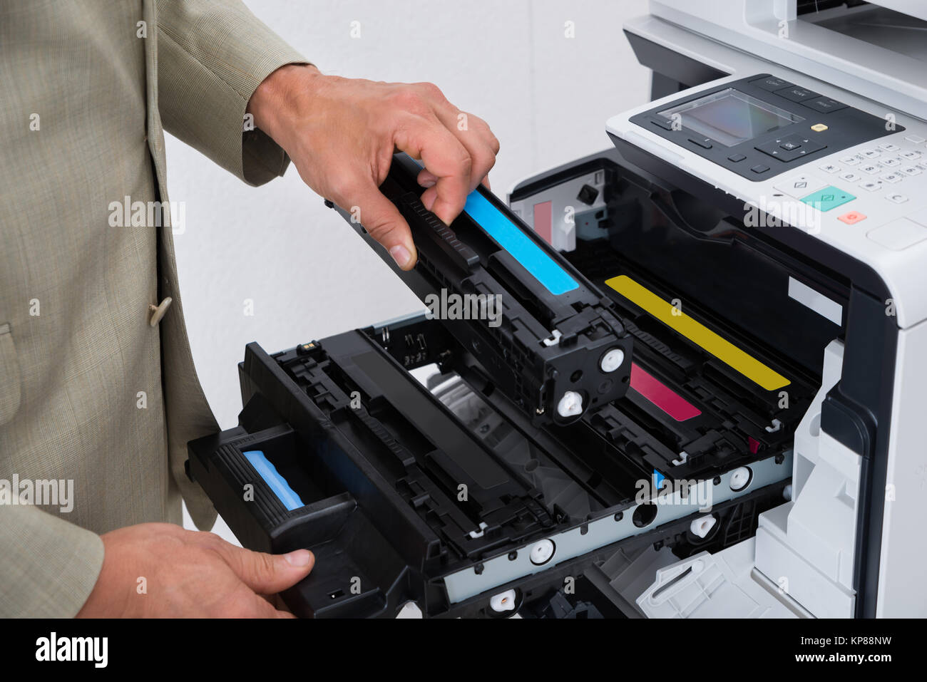 Businessman Fixing Cartridge In Photocopy Machine Stock Photo - Alamy