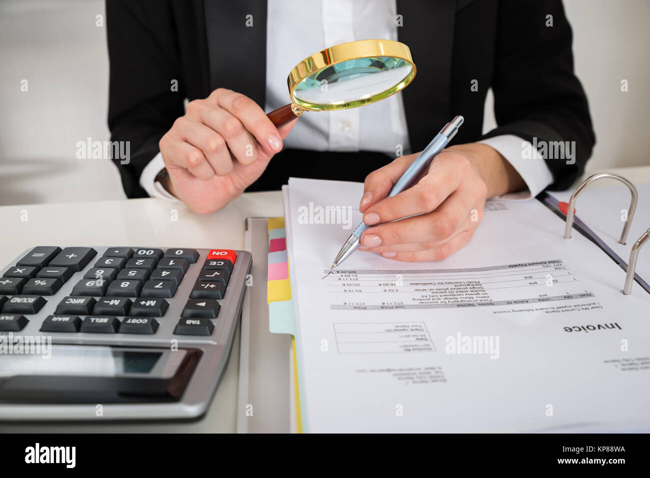 Female Auditor Analyzing Invoice Stock Photo - Alamy