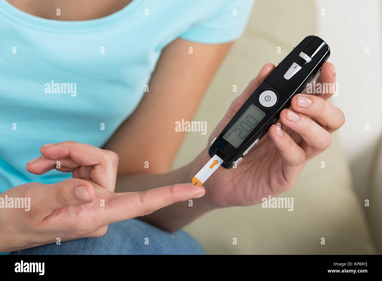 Woman Checking Blood Sugar Level Stock Photo - Alamy